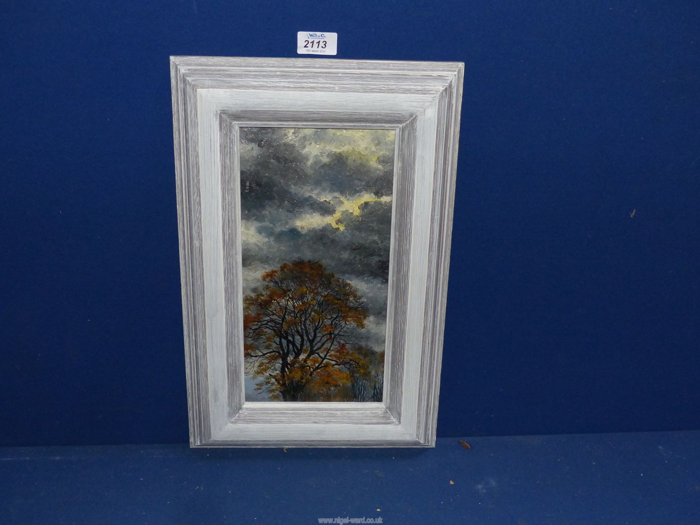 A framed Oil on board, signed verso Meg Stevens, depicting Trees on a ...