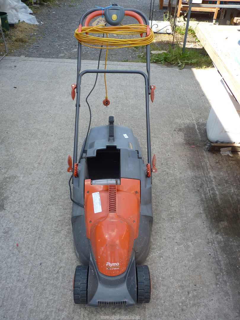 An electric "Flymo" lawn mower.