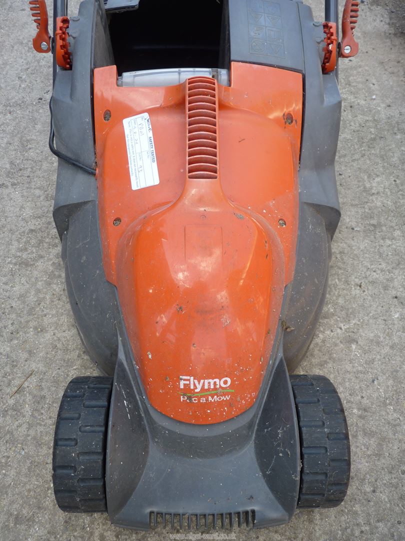 An electric "Flymo" lawn mower.