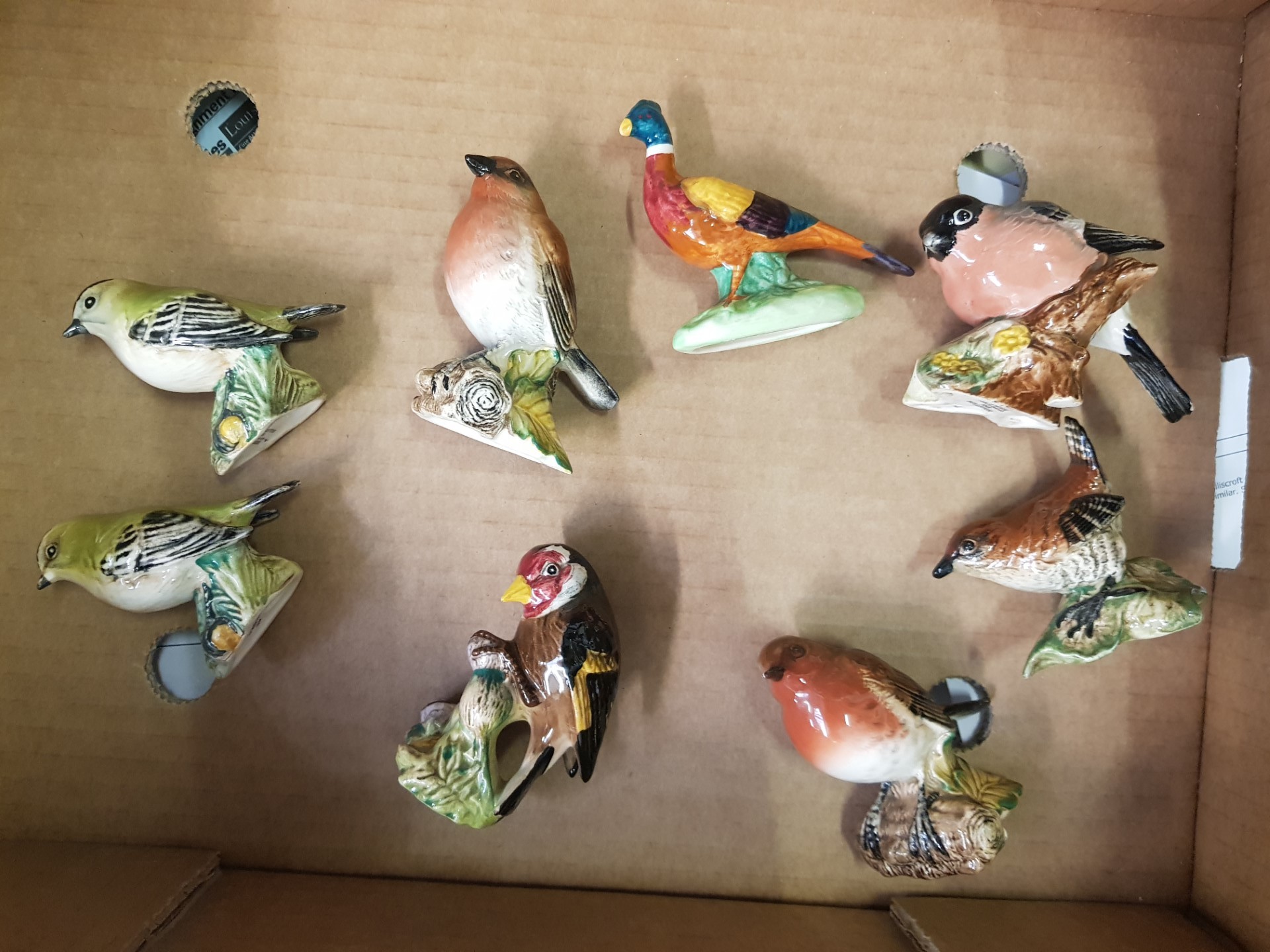 A collection of Beswick bird figures to include wren, robin x 2 ...