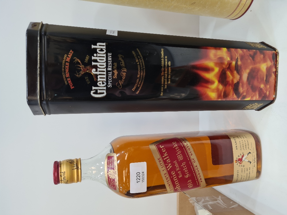 A vintage bottle of Johnnie Walker 1 Litre Scotch Whisky with red label ...