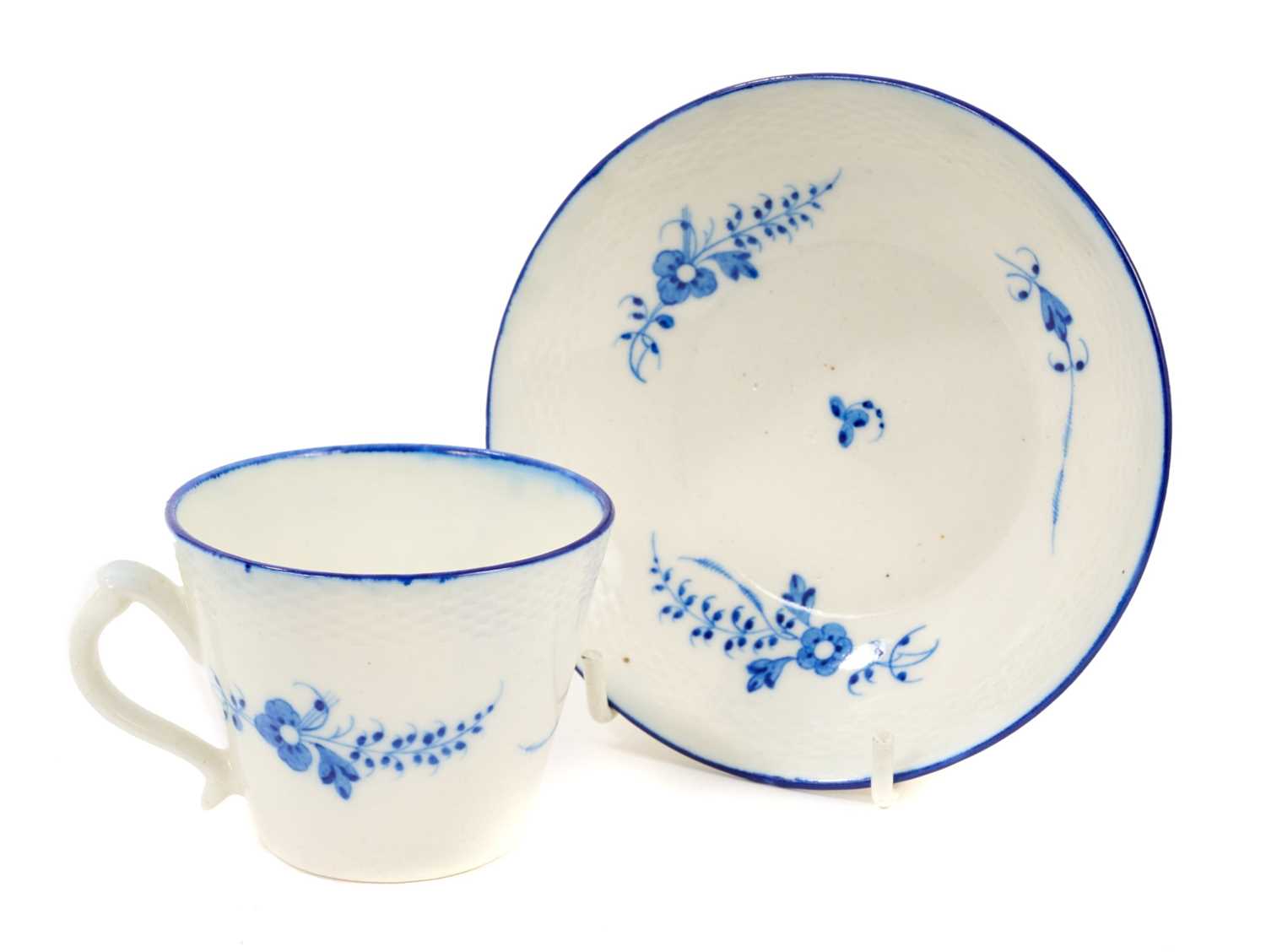 Caughley coffee cup and saucer, circa 1785, painted in blue with the ...