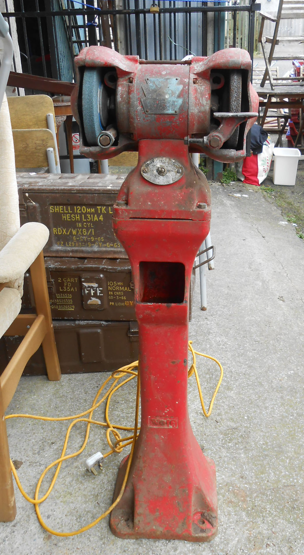 A vintage Wolf freestanding bench grinder