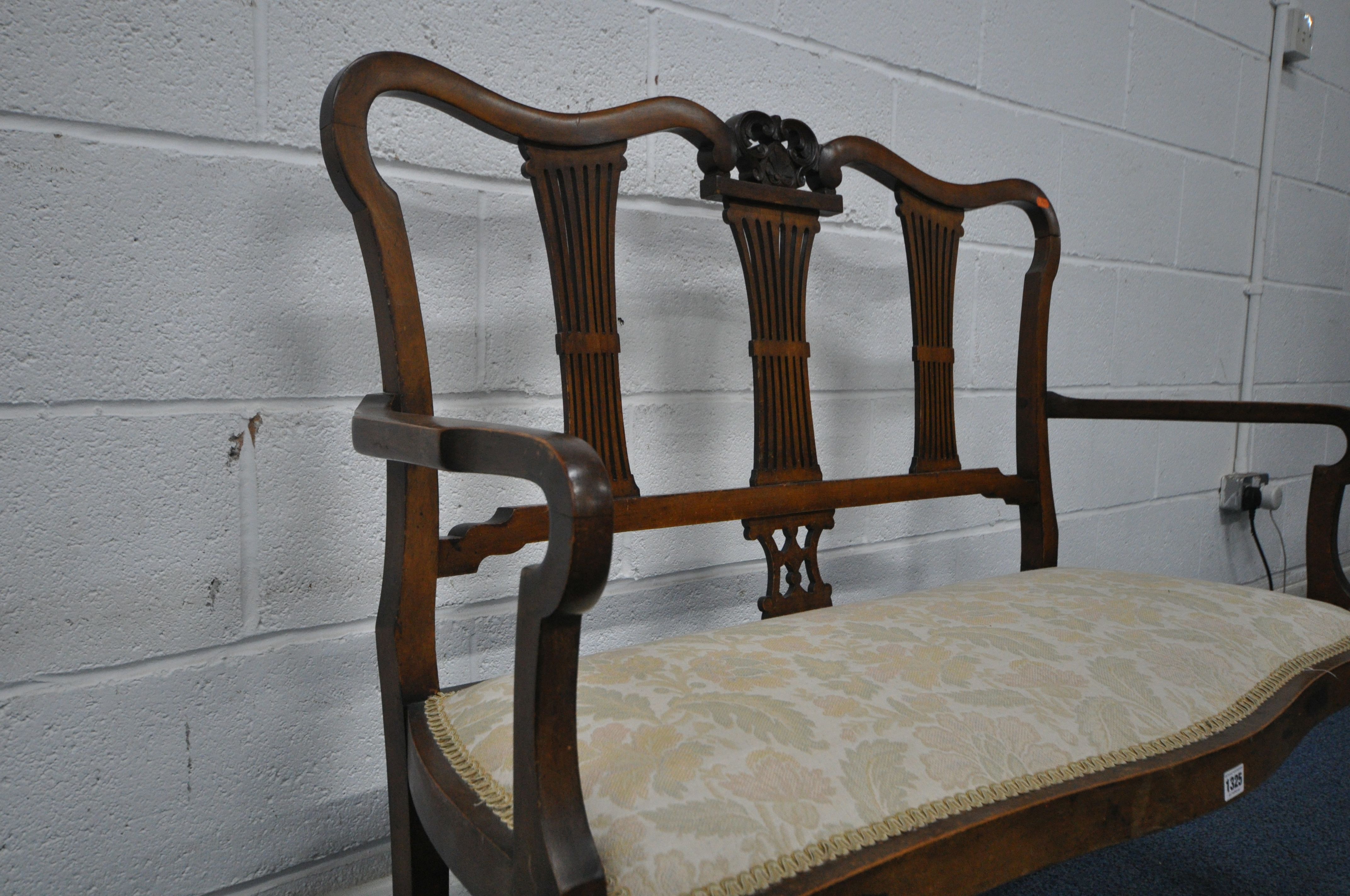 A VICTORIAN MAHOGANY SOFA, with wavy top and scrolled crest, three ...