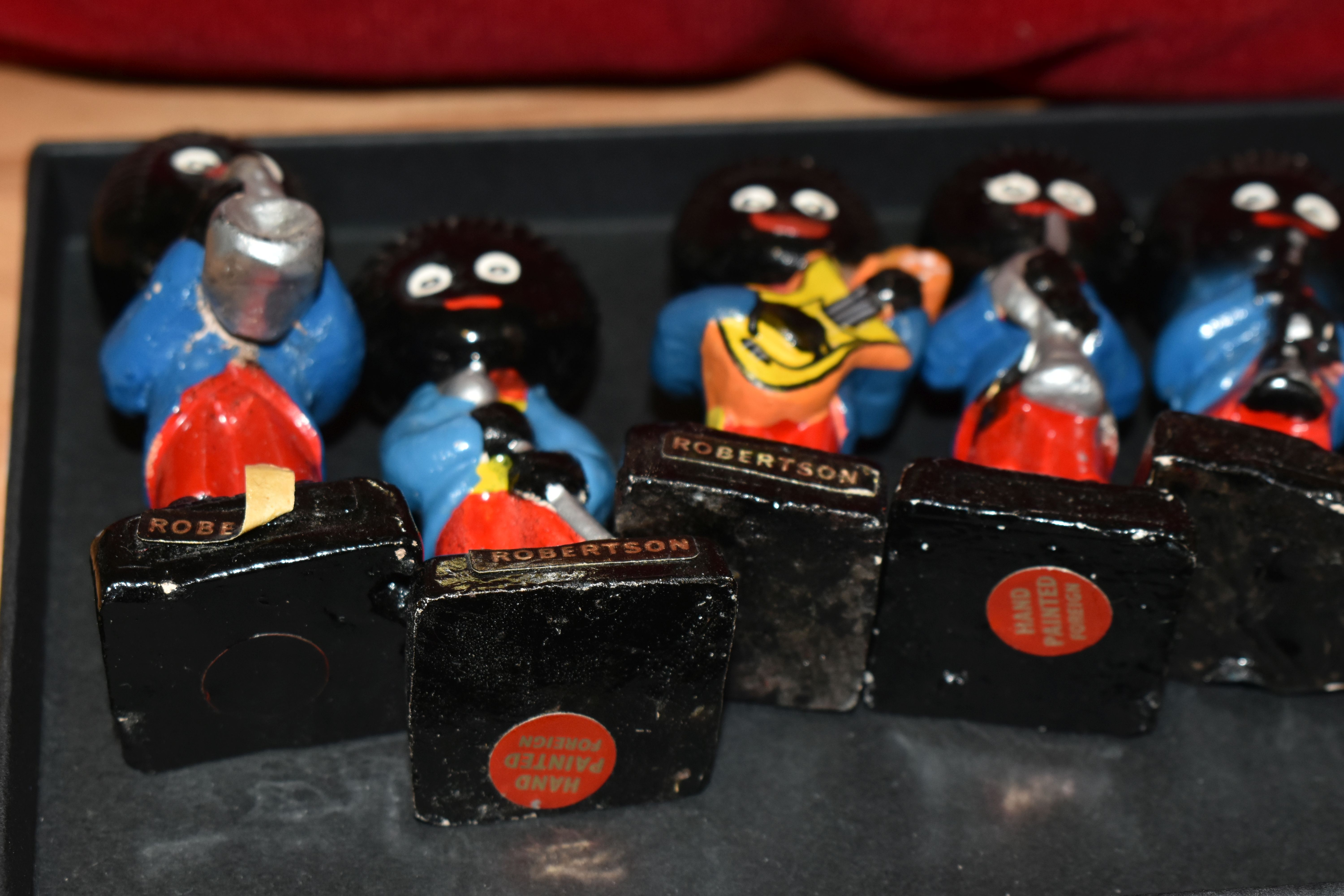A COLLECTION OF ROBERTSONS JAM FIGURES AND BADGES, comprising eight ...