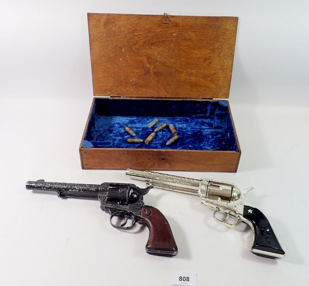 Two toy revolvers and fake bullets - Rustler 45 and Lone Star Range ...