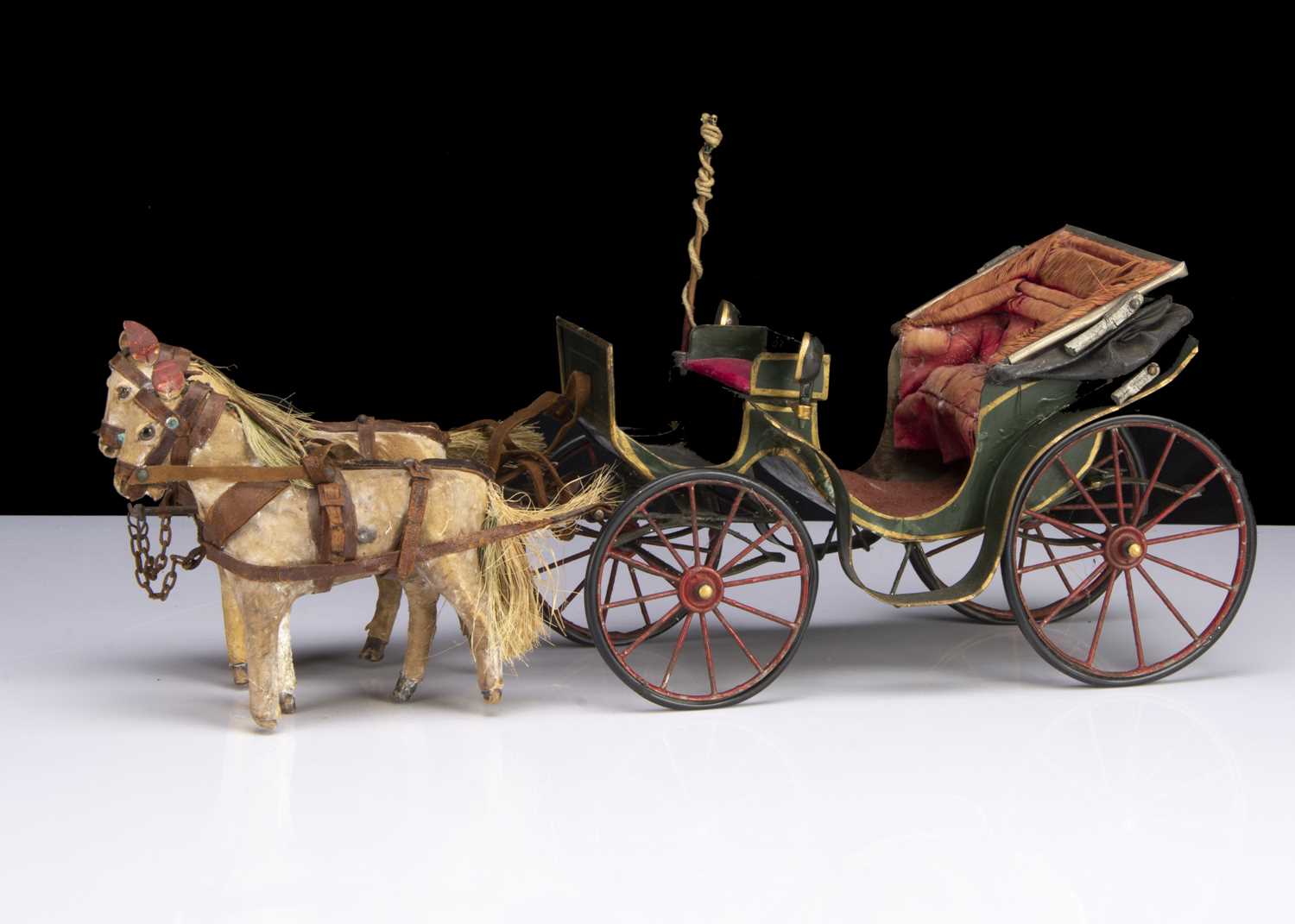 A late 19th century French tinplate Victoria carriage, painted dark ...