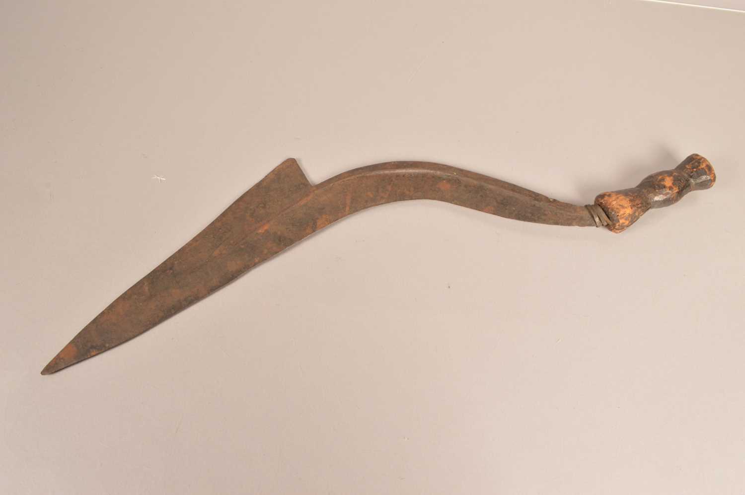 An African Sickle, with curved single edged blade leading to a large ...