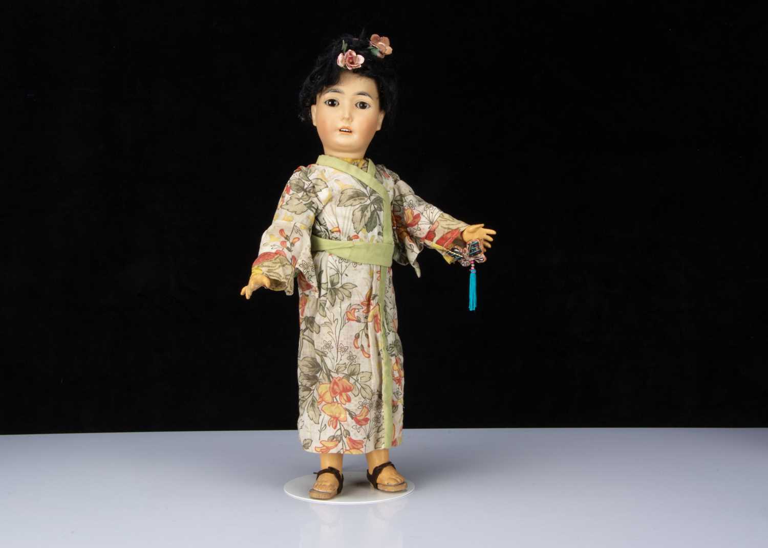 A Simon & Halbig 164 Asian child doll, with brown sleeping eyes, black ...