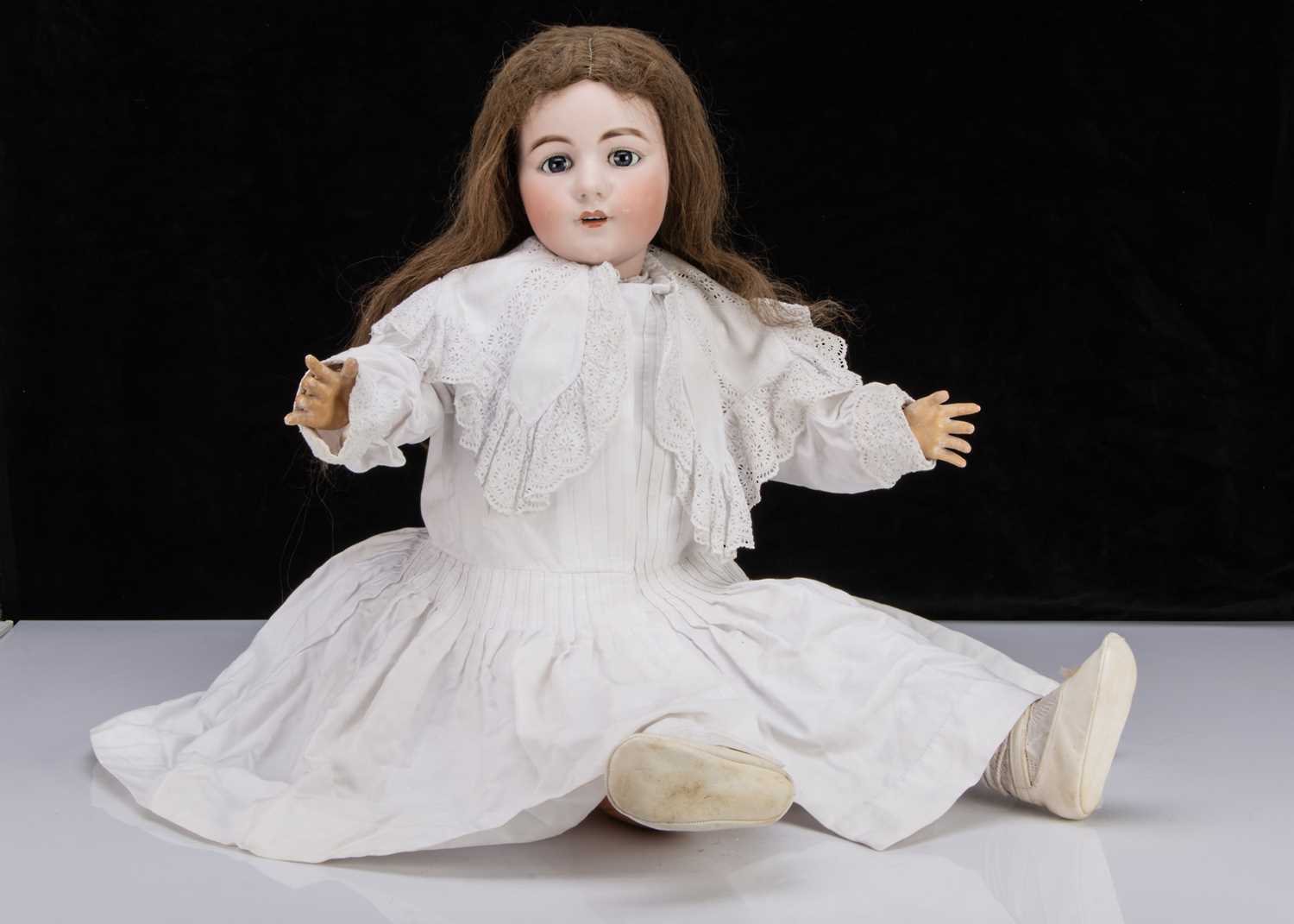 A large Simon & Halbig 949 DEP child doll, with fixed blue glass eyes ...