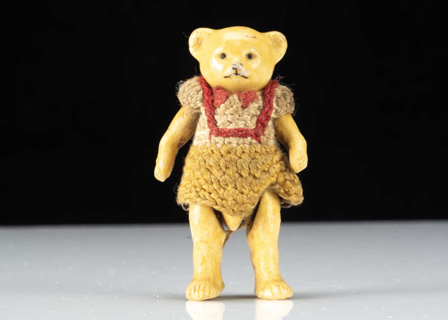 A Hertwig all-bisque dolls’ house teddy bear boy doll, painted yellow ...