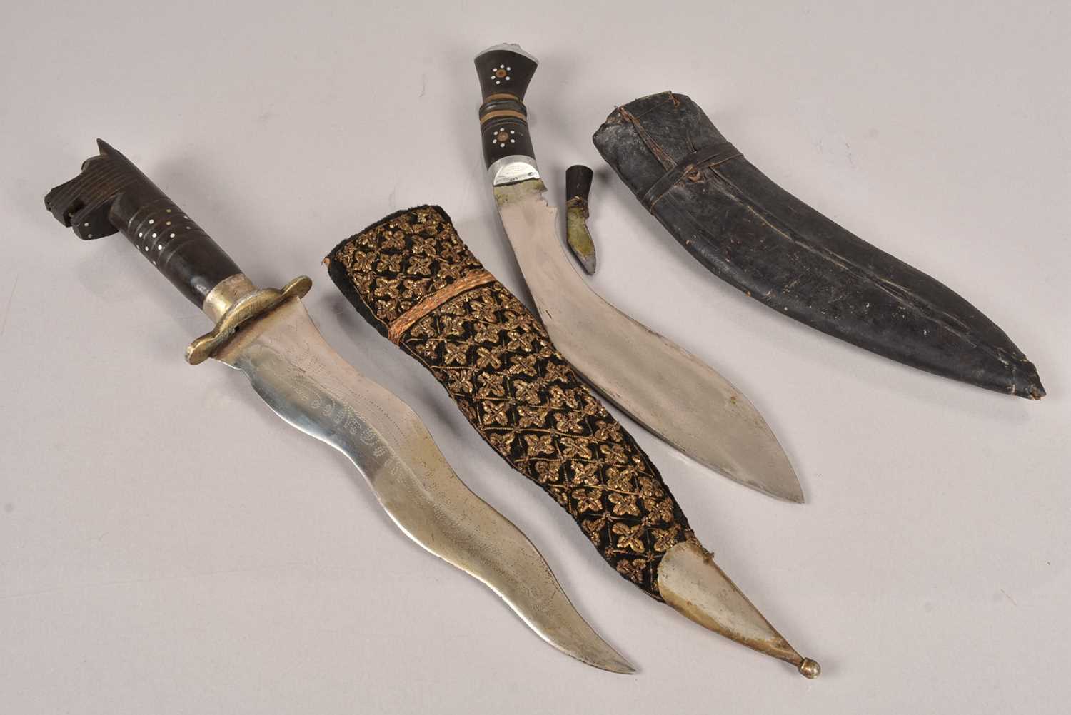 An Indian Kris Style knife, having 23cm long double edged blade, in the ...