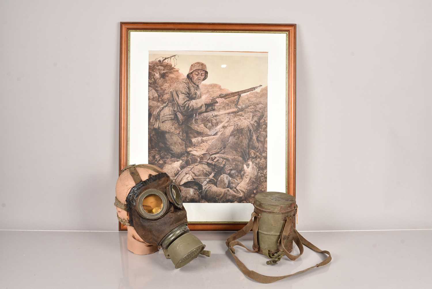 A German M17 Gas Mask, complete with carry tin, together with a German ...
