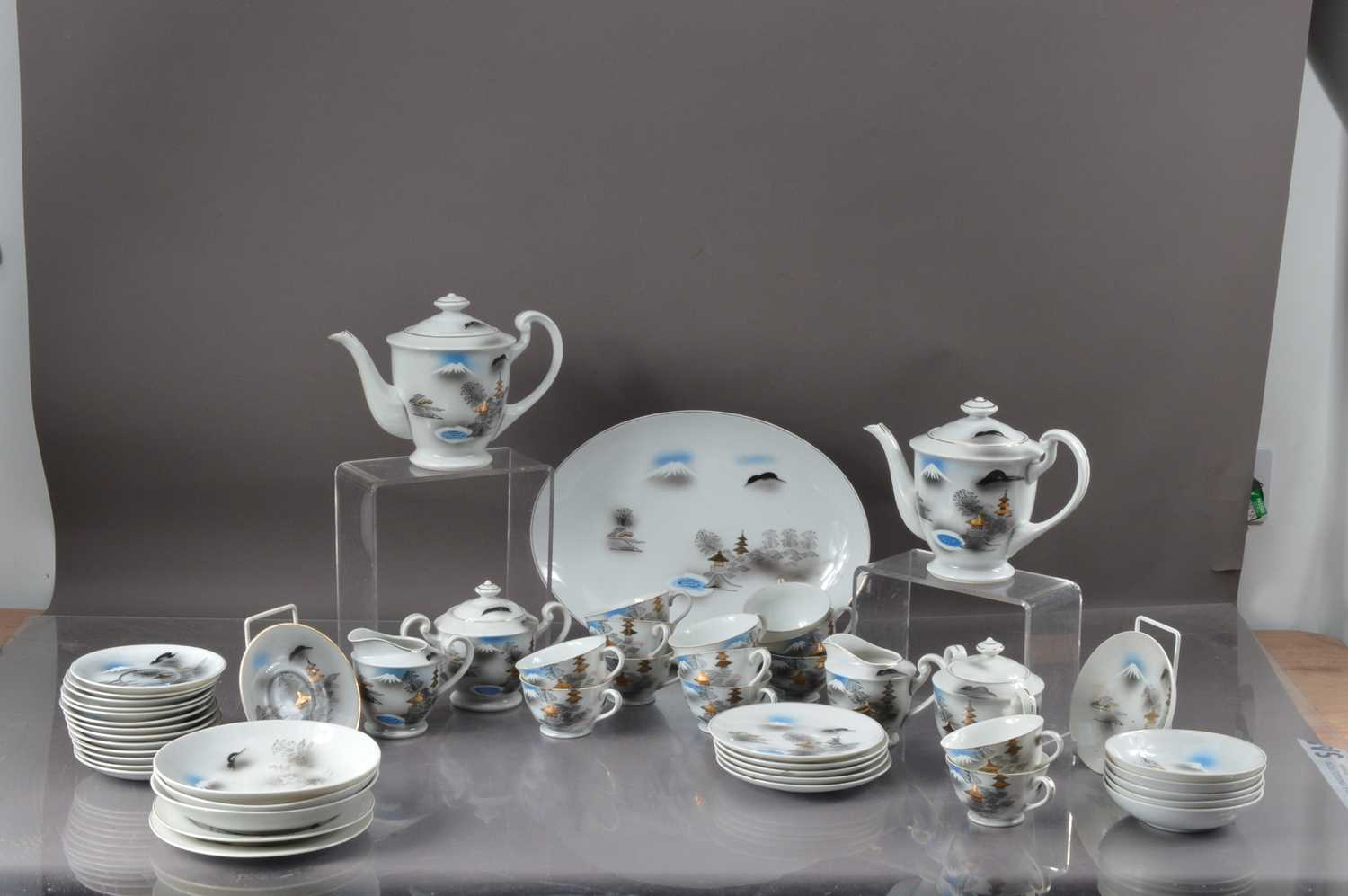 An extensive Japanese eggshell tea service, with a lithophane of a ...
