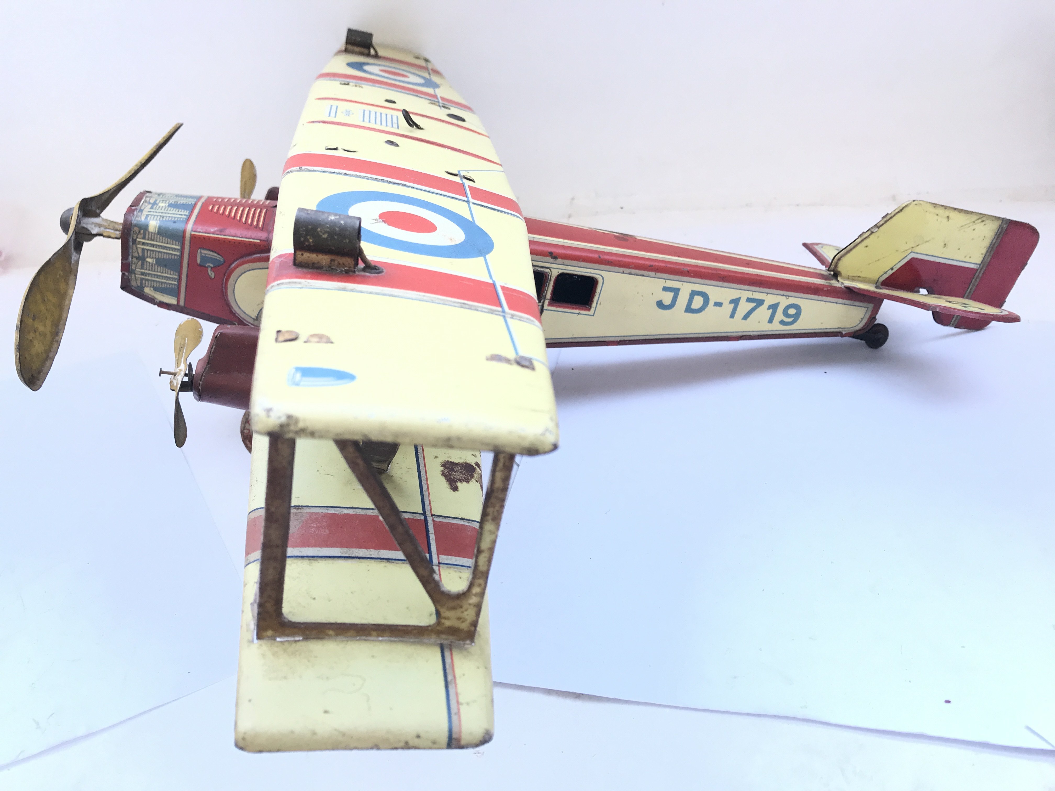 A Vintage Tin plate Clockwork Bi-Plane. Seen Working. Approx length ...