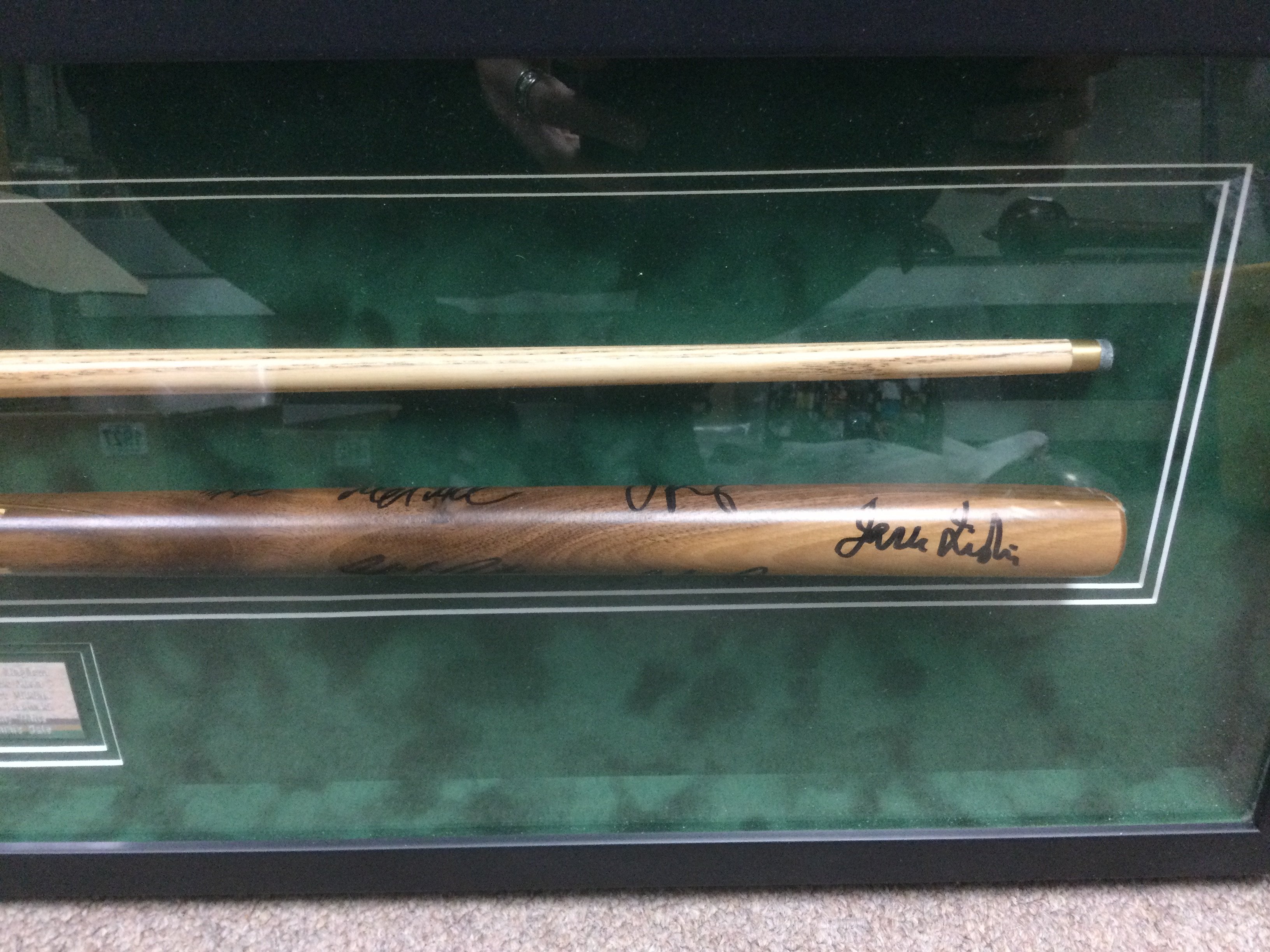 A framed and glazed multi signed snooker cue, various names include ...