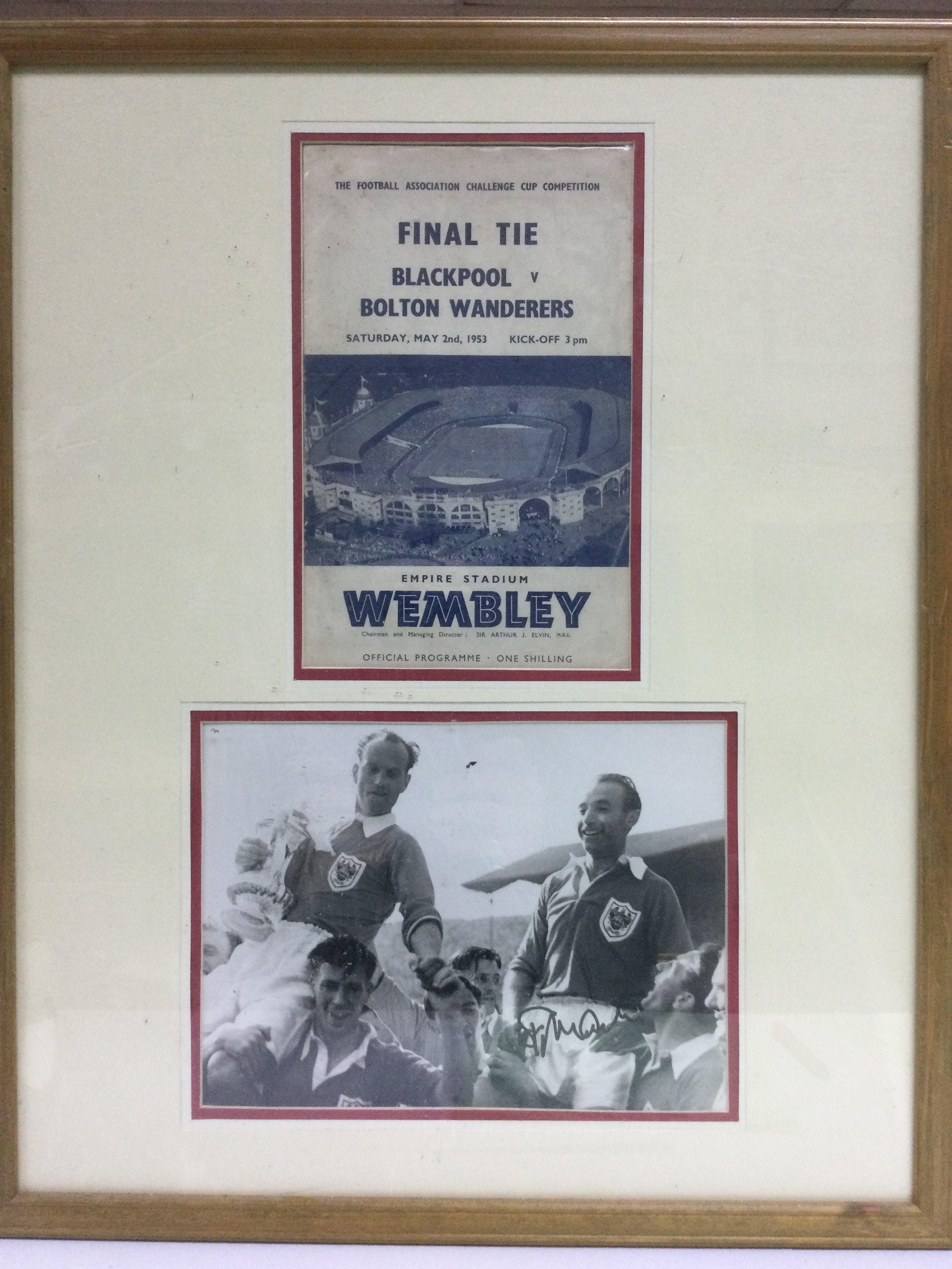 A framed and glazed Sir Stanley Matthews display with signed black and ...