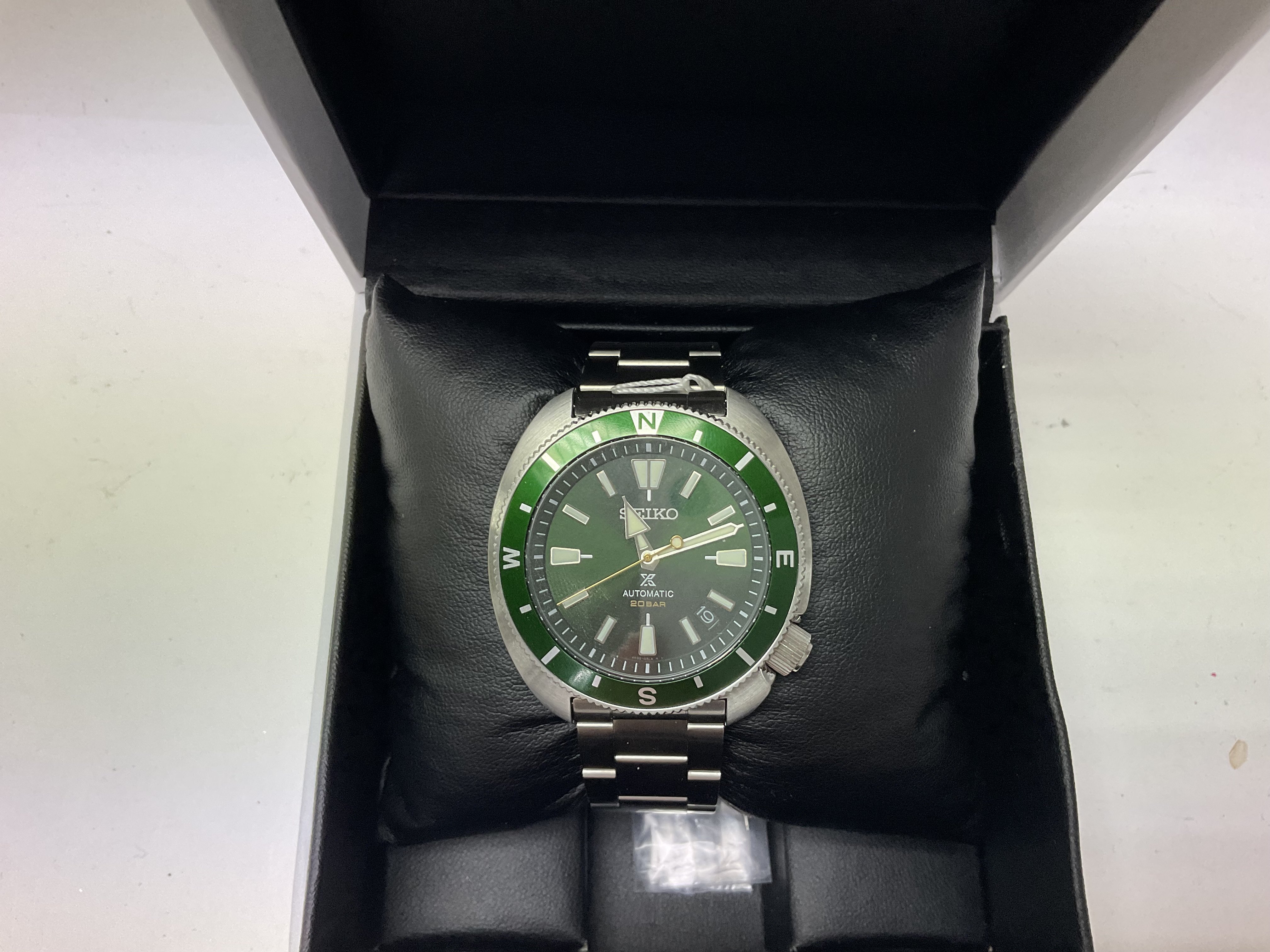 A boxed seiko tortoise divers watch with green dial and bezel with card ...