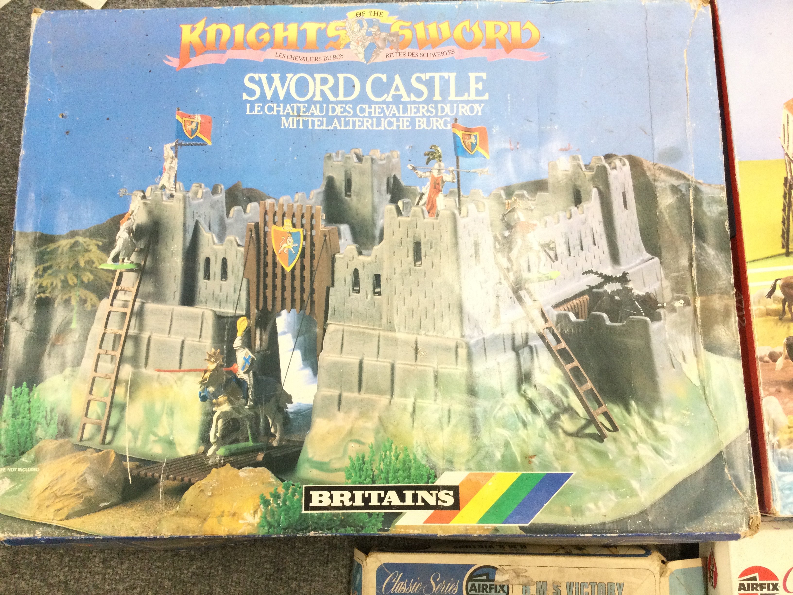 A Boxed Britains Farm house and Farmyard. A sword Castle. And 3 Airfix ...