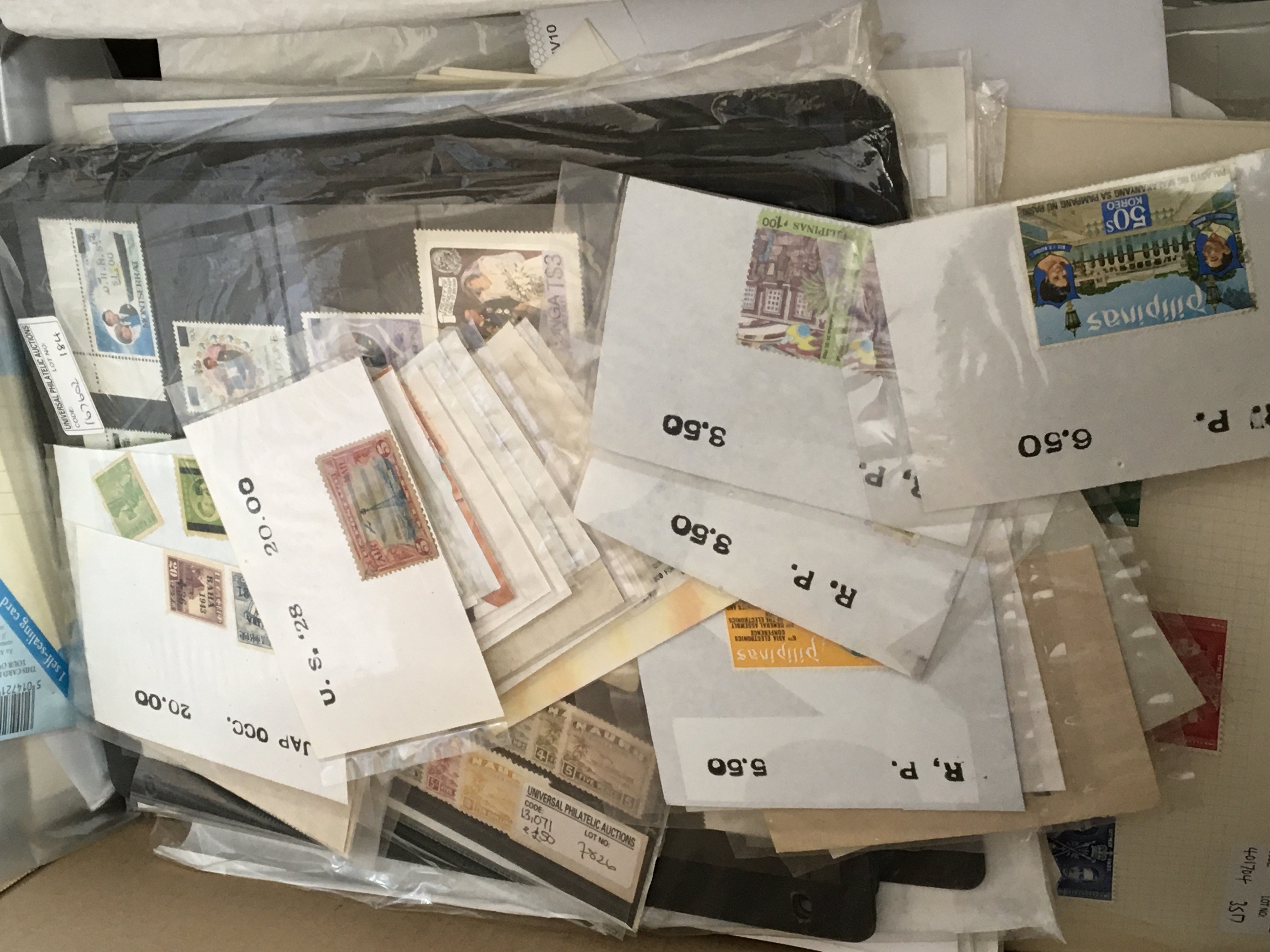 A box containing a large quantity of World stamps presented on sheets ...