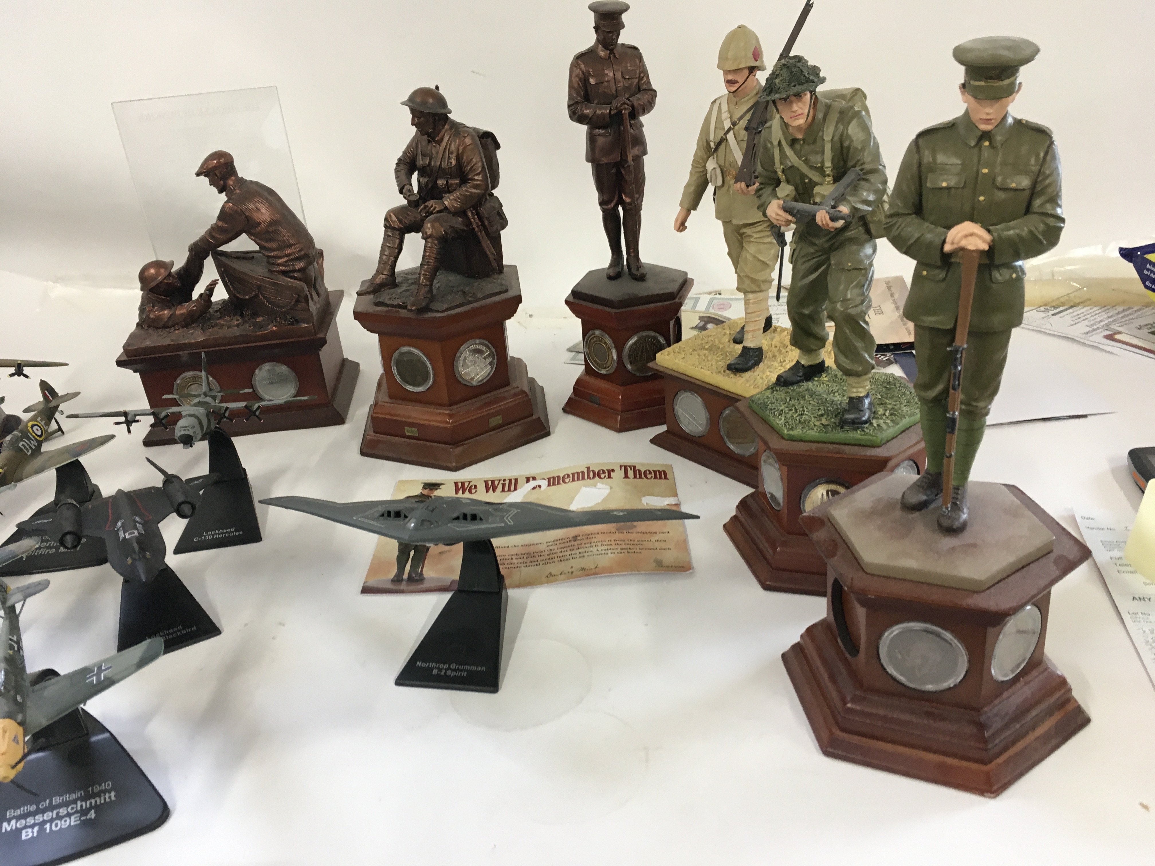 A collection of miliatary model memorabilia relating to various wars ...