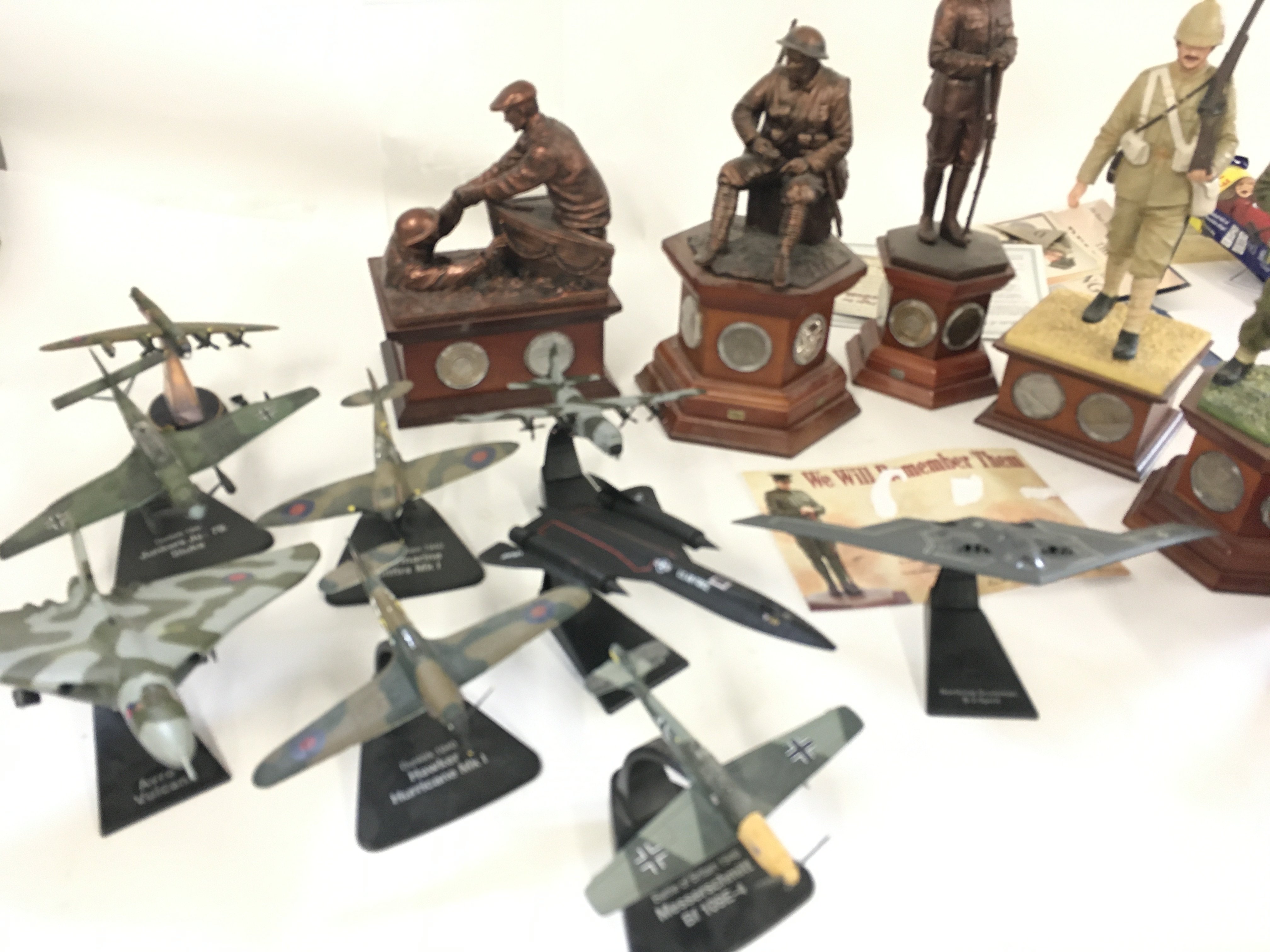 A collection of miliatary model memorabilia relating to various wars ...