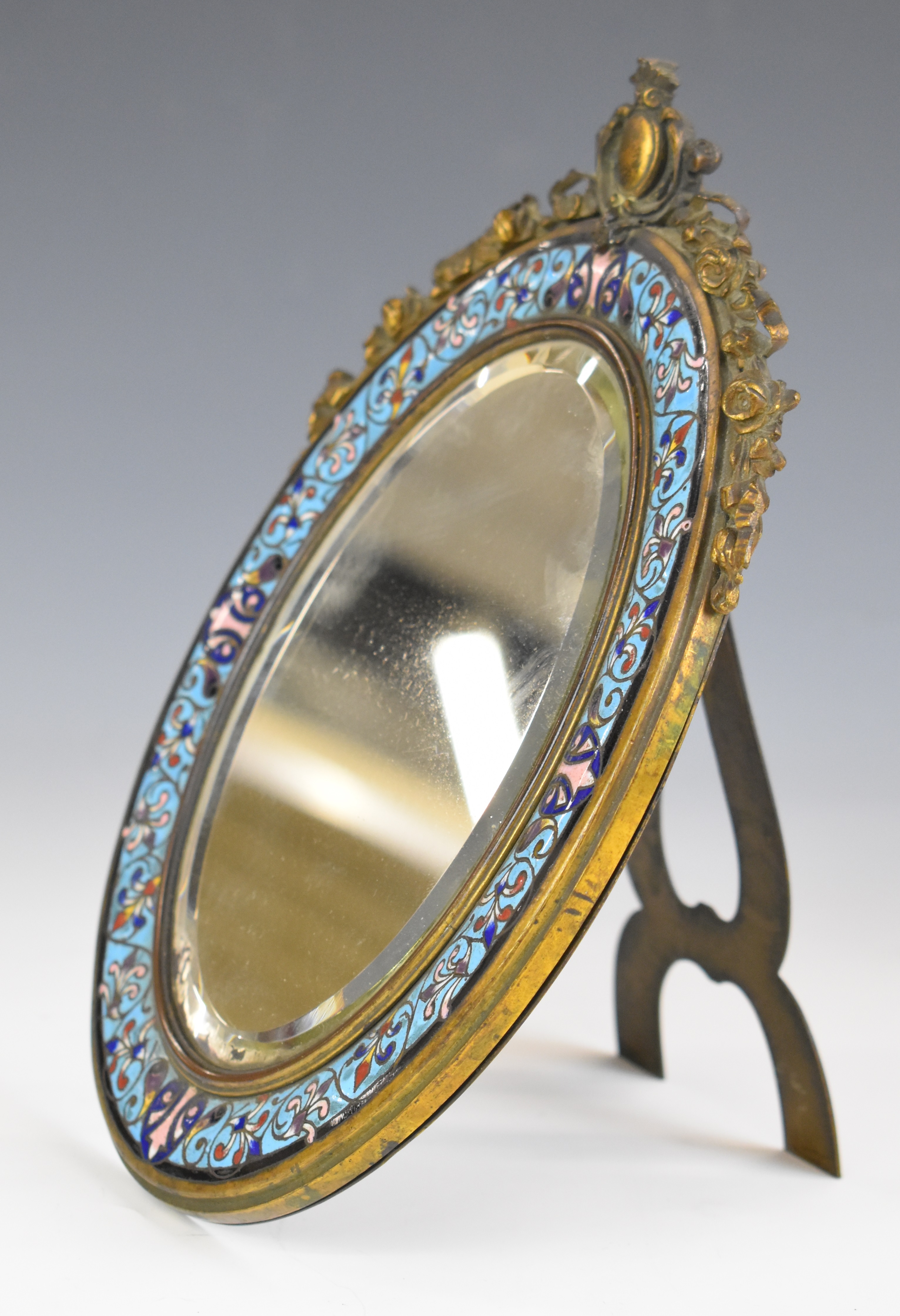 A 19thC brass and champlevé enamel easel back bevelled glass mirror ...