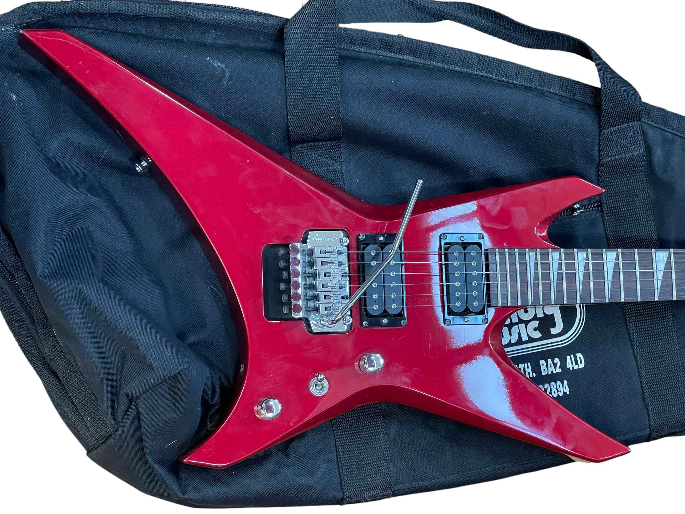 Jackson WRXT Warrior X Series Inferno red electric guitar with canvas bag.