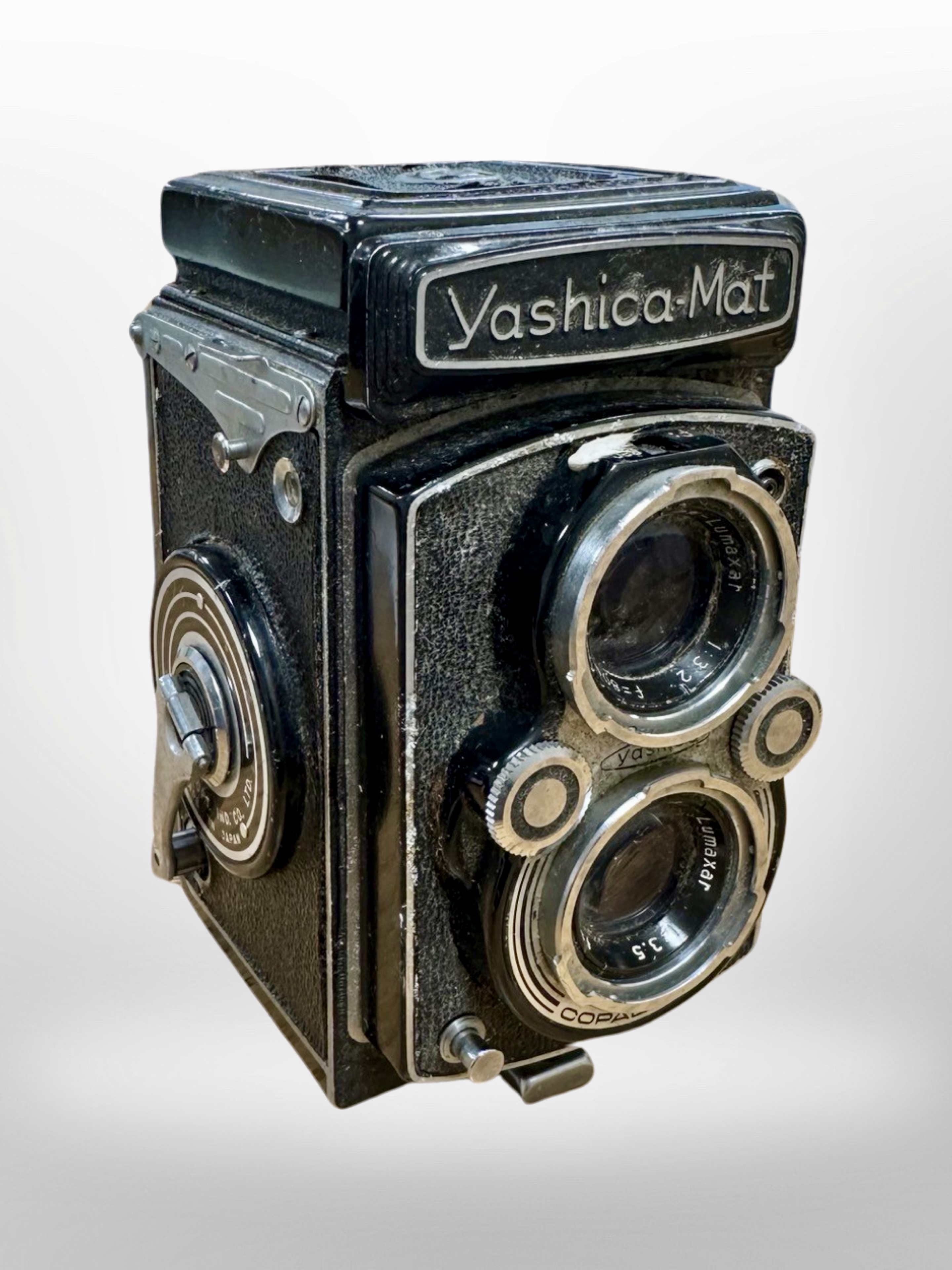 A Yashica-Mat Copal camera numbered 57100180