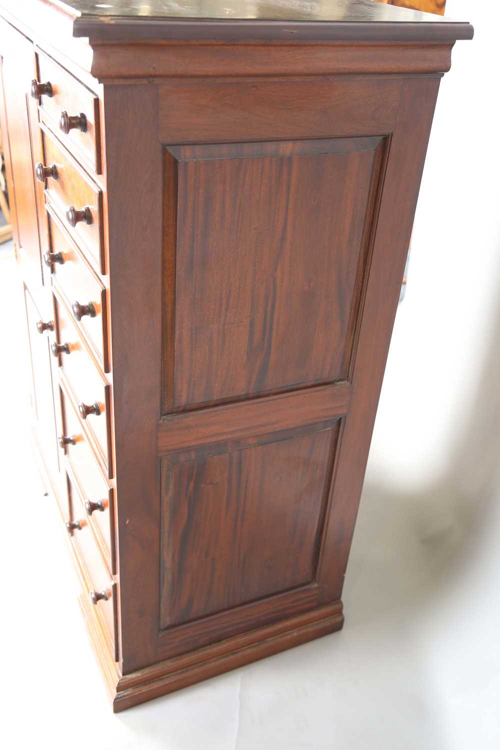 A modern hardwood bedroom tallboy, fitted with a fielded panel door and ...