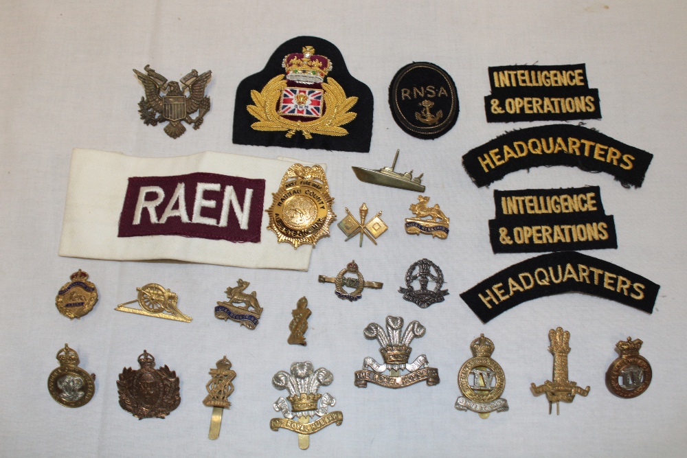 A selection of various military badges and other insignia including ...