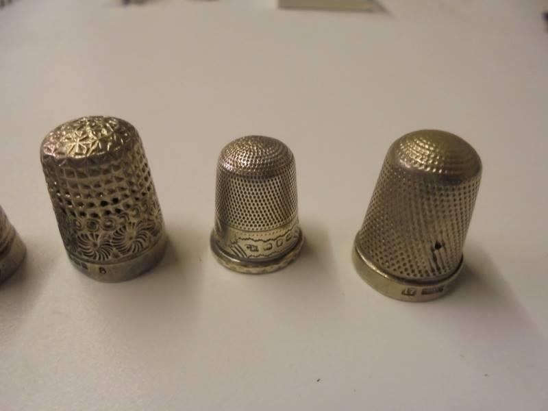 Seven silver thimbles. 1.2 oz.