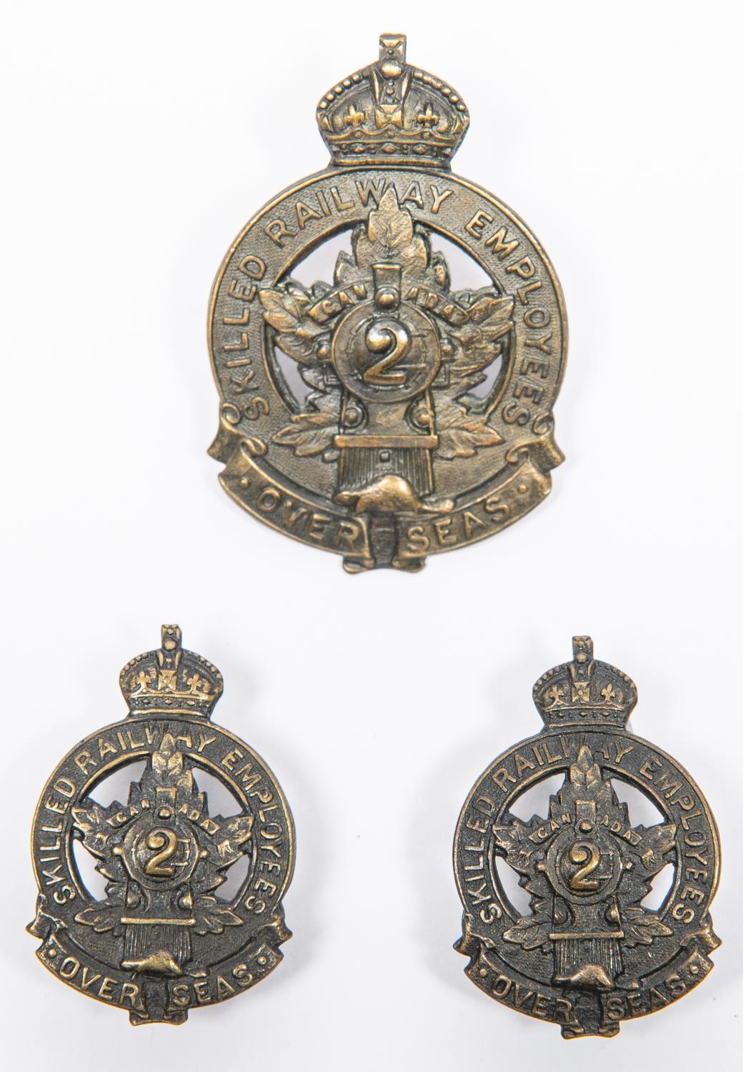 WWI CEF 2nd Overseas Skilled Railway Employees cap badge, and a pair of ...