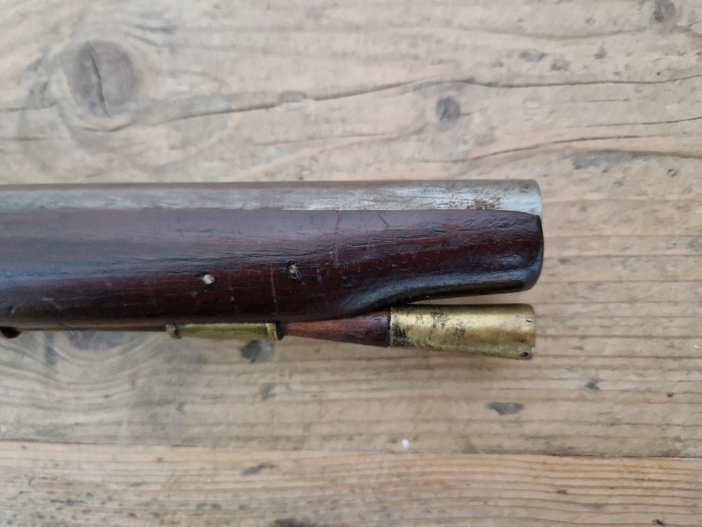 A pair of reproduction flintlock pistols, 31cm barrel with ramrod below ...