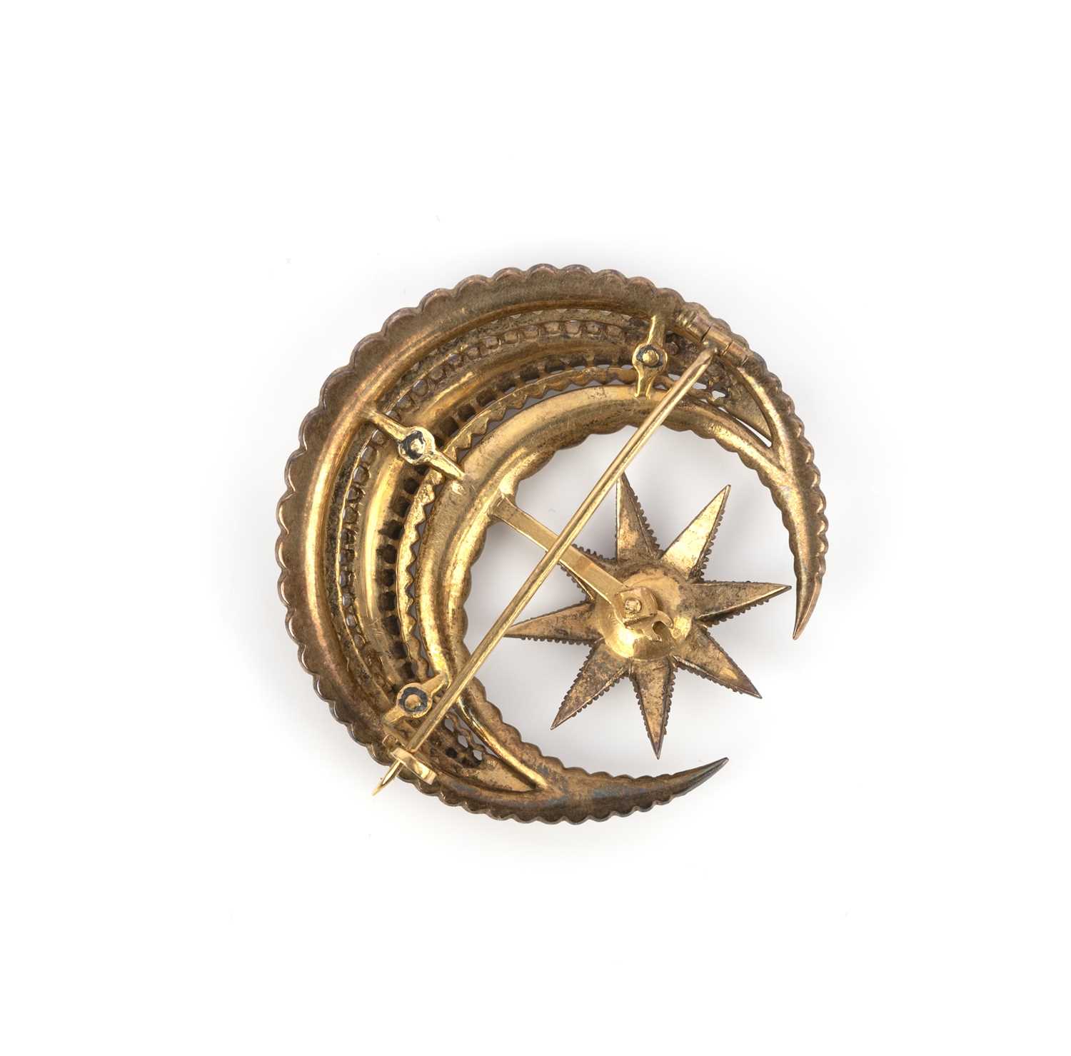 A diamond brooch, designed as the Islamic symbol of the crescent moon ...