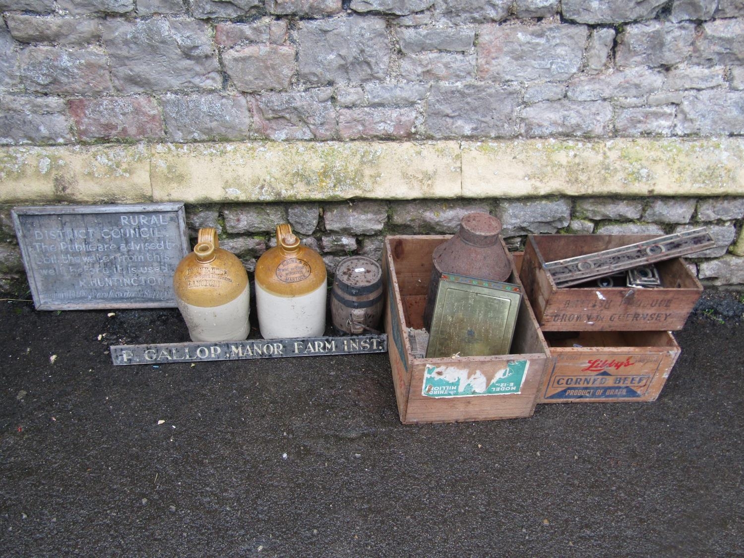 Two vintage stoneware flagons with impressed and printed merchants ...