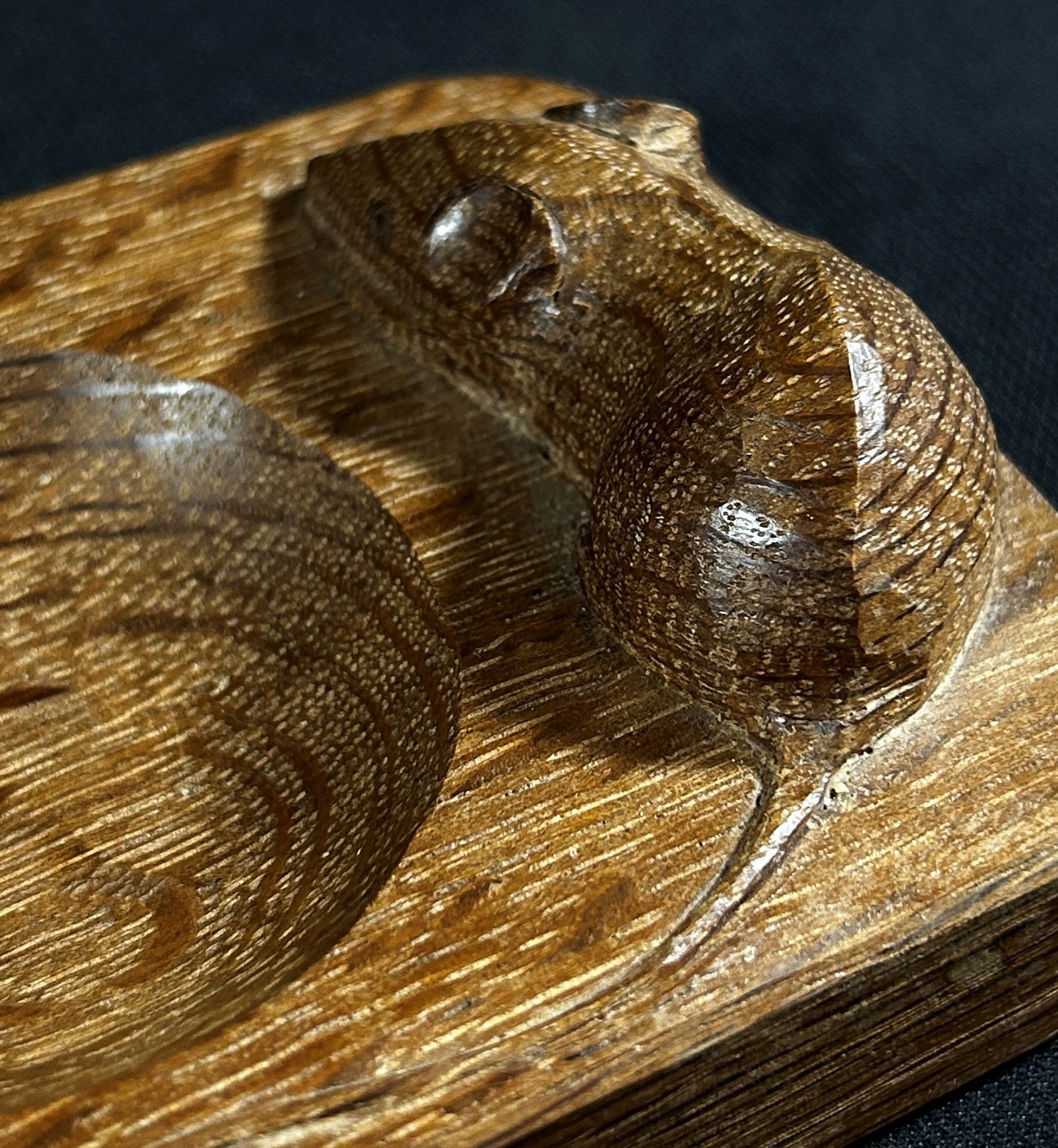A Robert Thompson of Kilburn 'Mouseman' oak pin tray surmounted by a ...