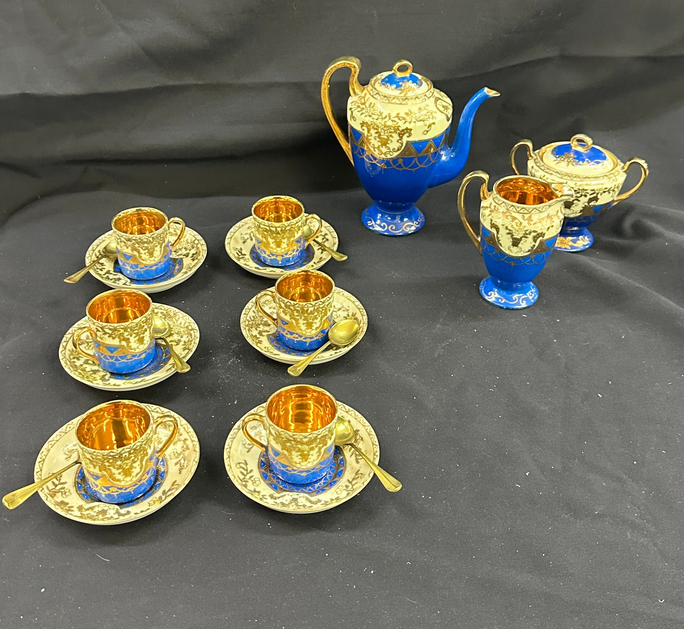 A 6 piece hand painted coffee set ' Genuine Samurai China' with spoons