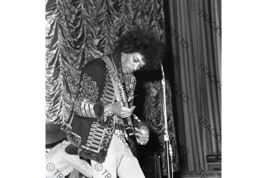 ˑ A pair of black and white negatives bearing images of Jimi Hendrix ...