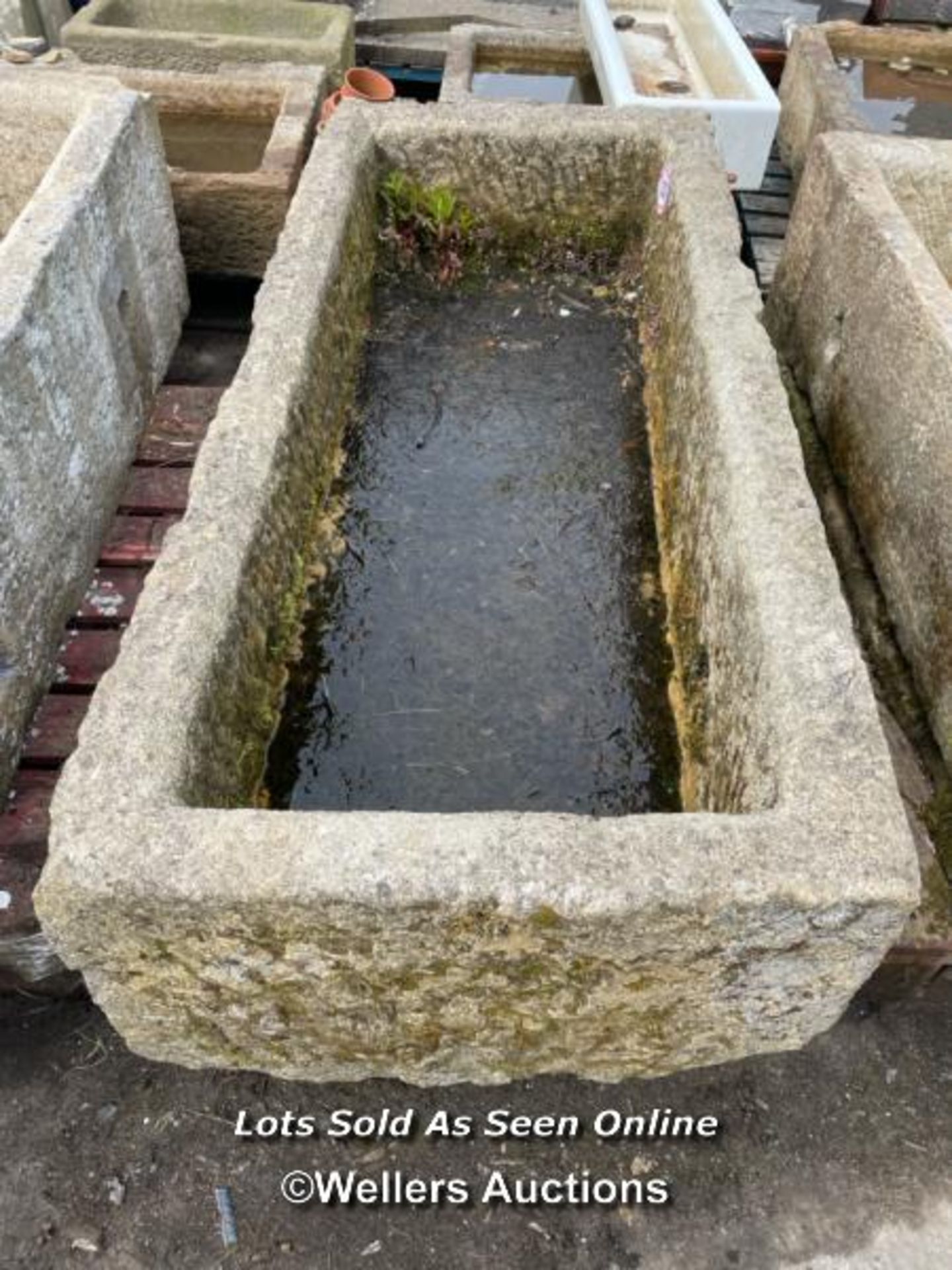 *A LARGE GRITSTONE QUARRY TROUGH, 45CM (H) X 170CM (L) X 76CM (W)
