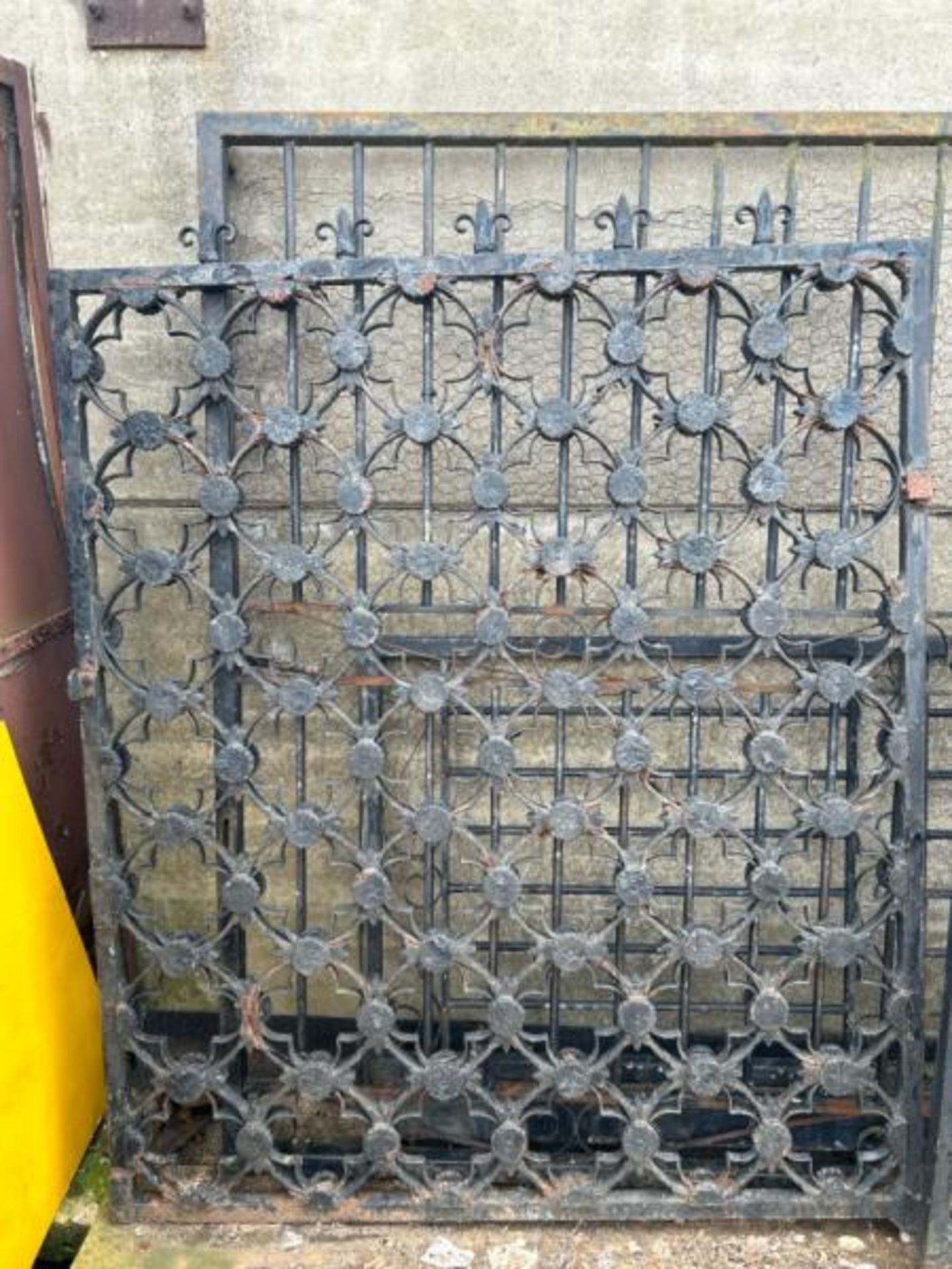 A PAIR OF HEAVY ORNATE WROUGHT IRON ENTRY GATES WITH POINTED DETAILING ...