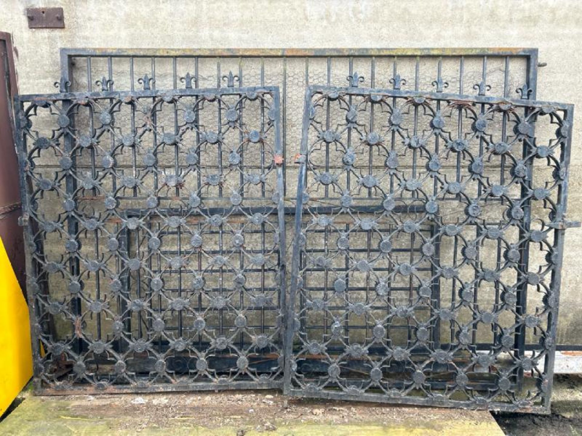 A PAIR OF HEAVY ORNATE WROUGHT IRON ENTRY GATES WITH POINTED DETAILING ...