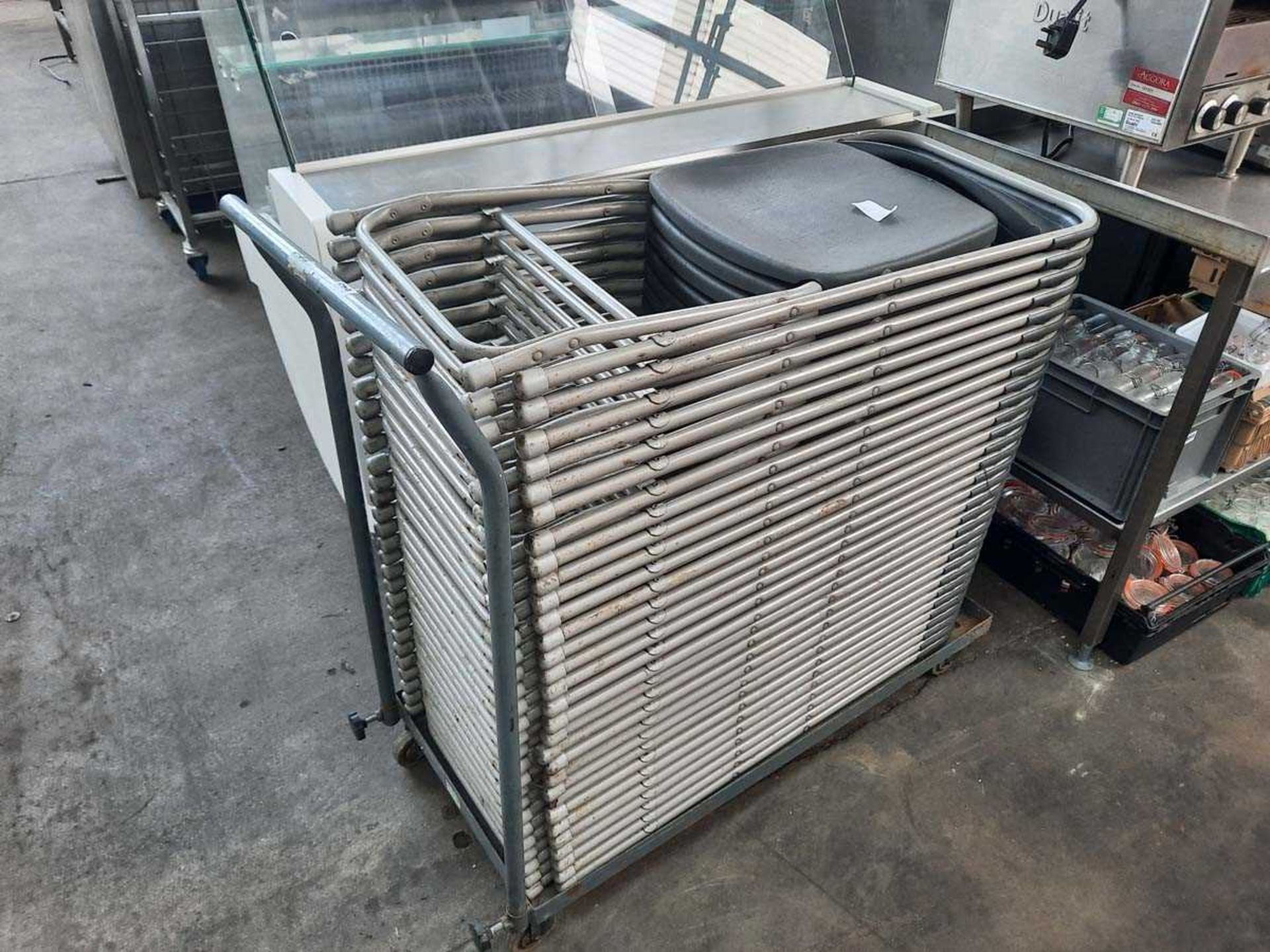 Trolley with stack of folding chairs