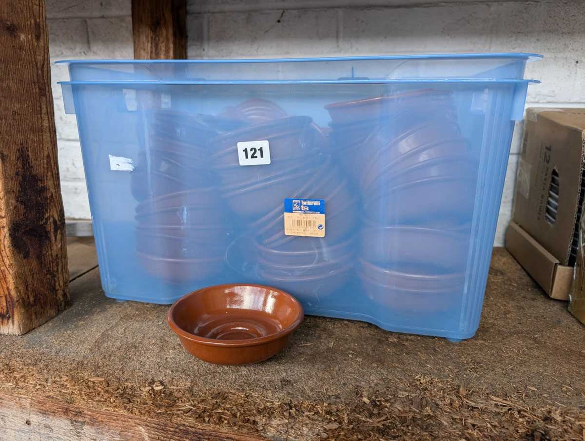 Large box containing brown tapas type dishes