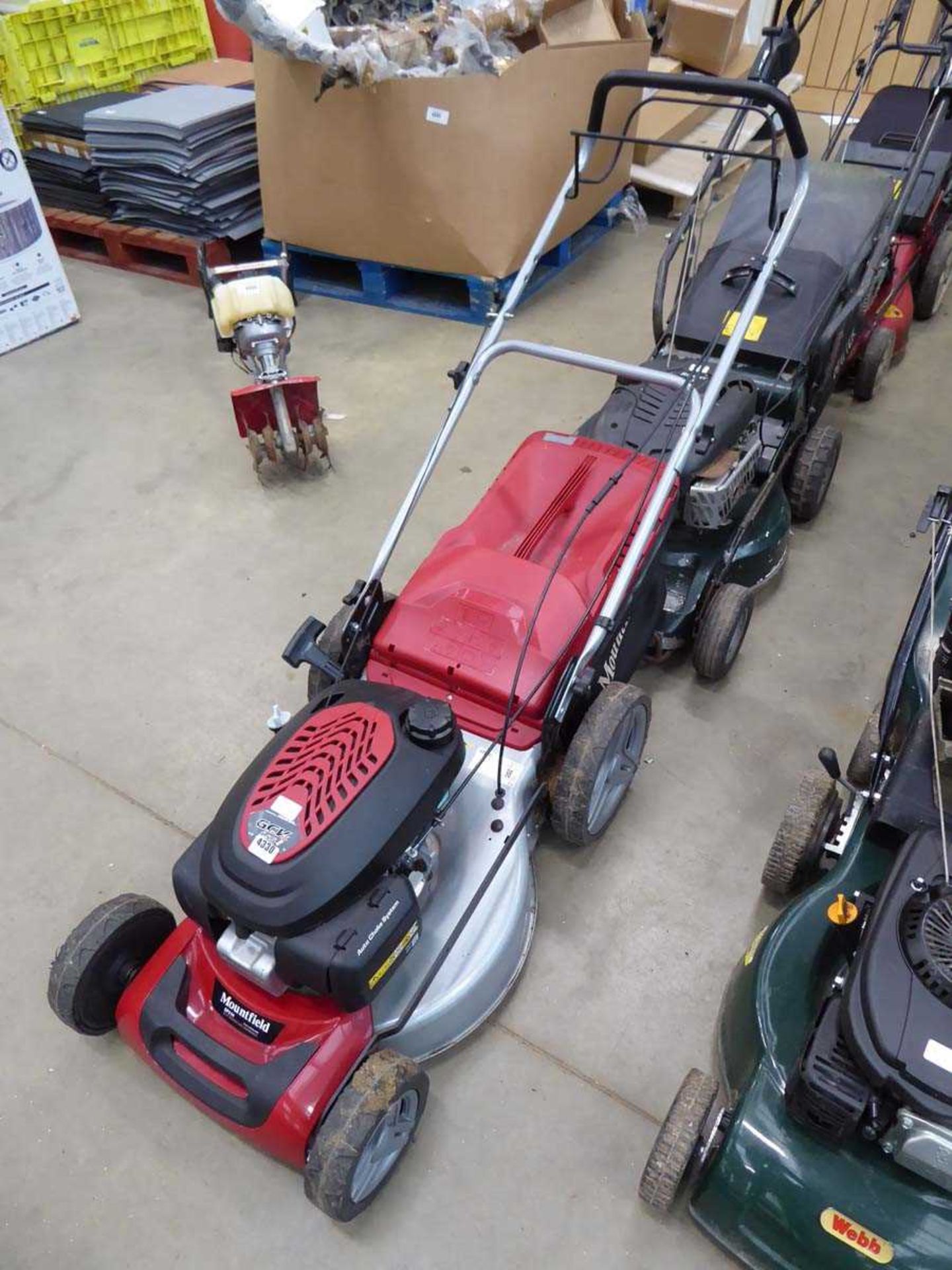 Mountfield red and silver petrol powered rotary mower with grass box