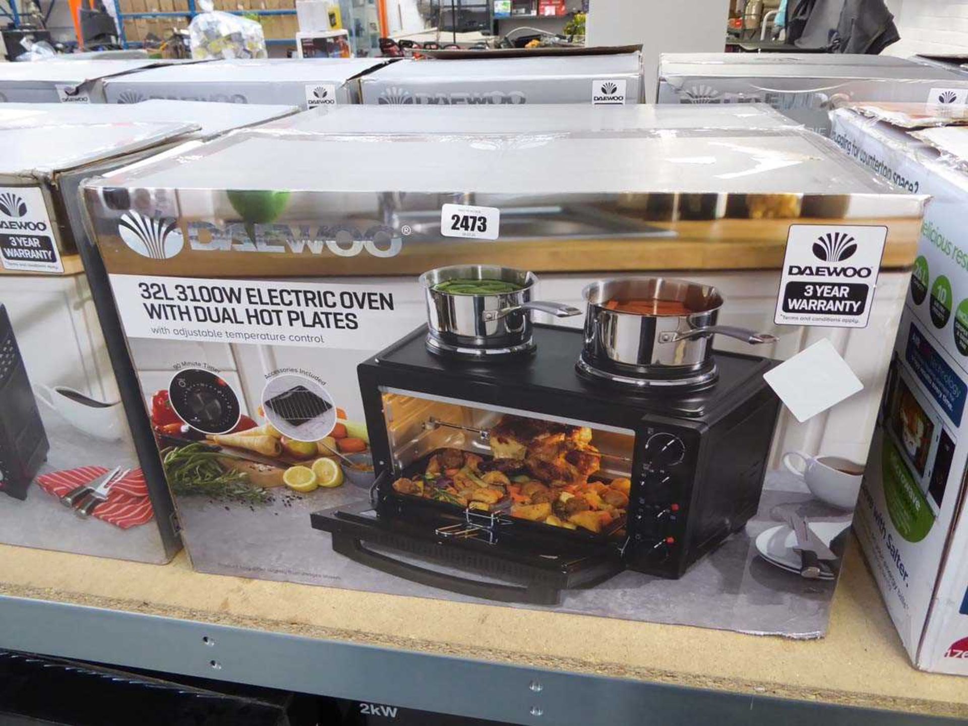 Boxed Daewoo 32L electric oven with dual hot plates
