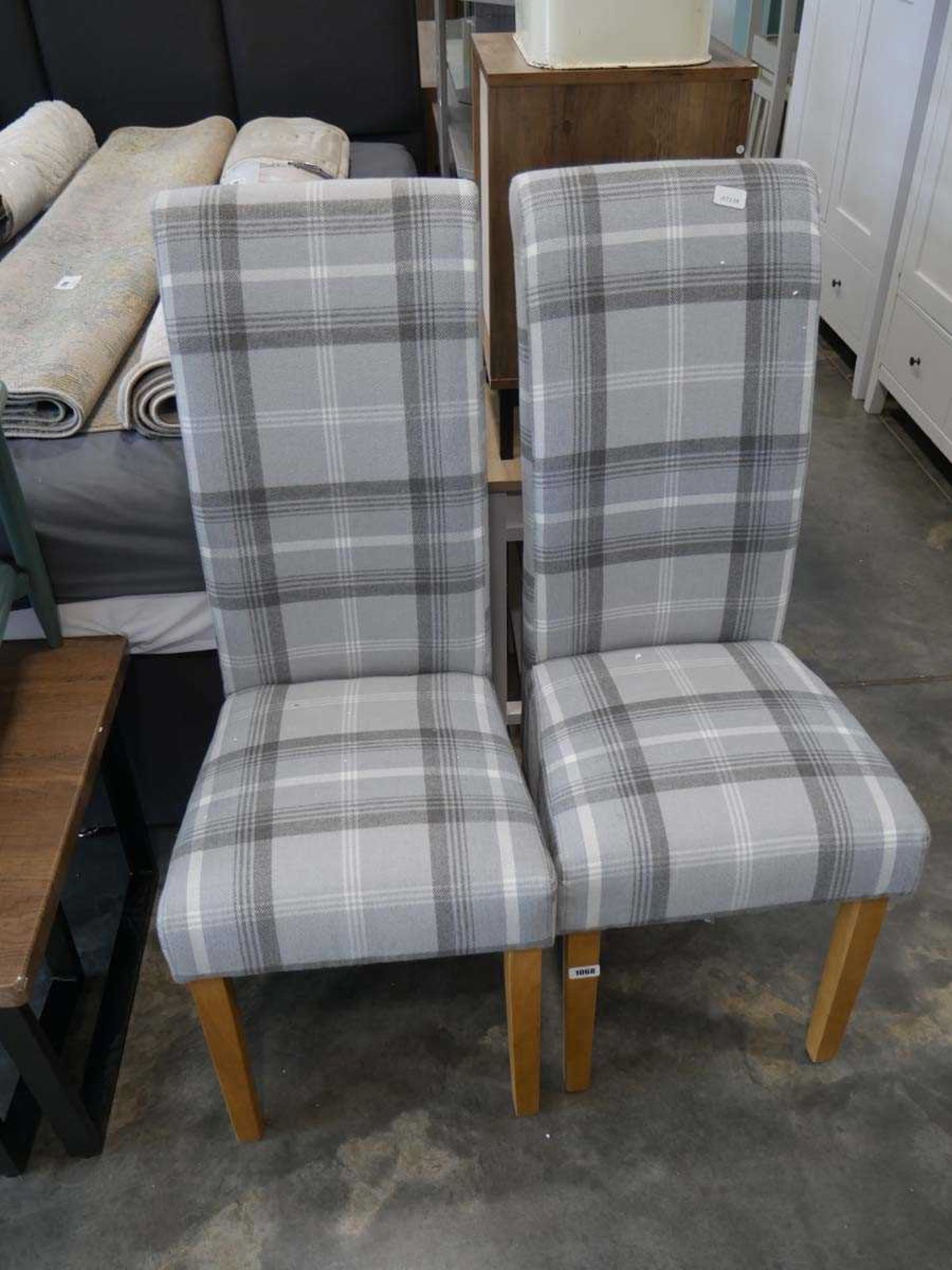Pair of high back check upholstered dining chairs