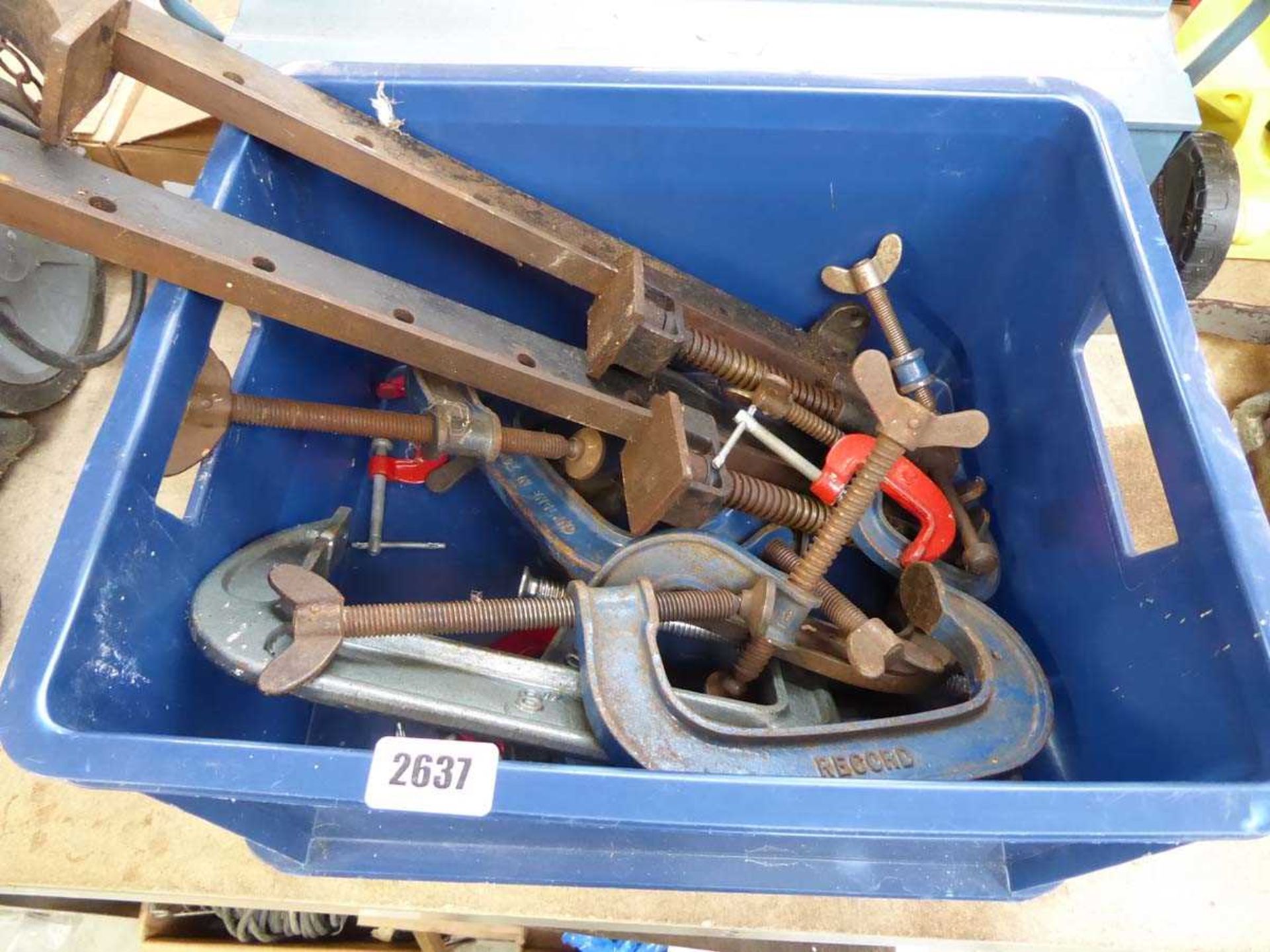 Box containing various G clamps and sash clamps