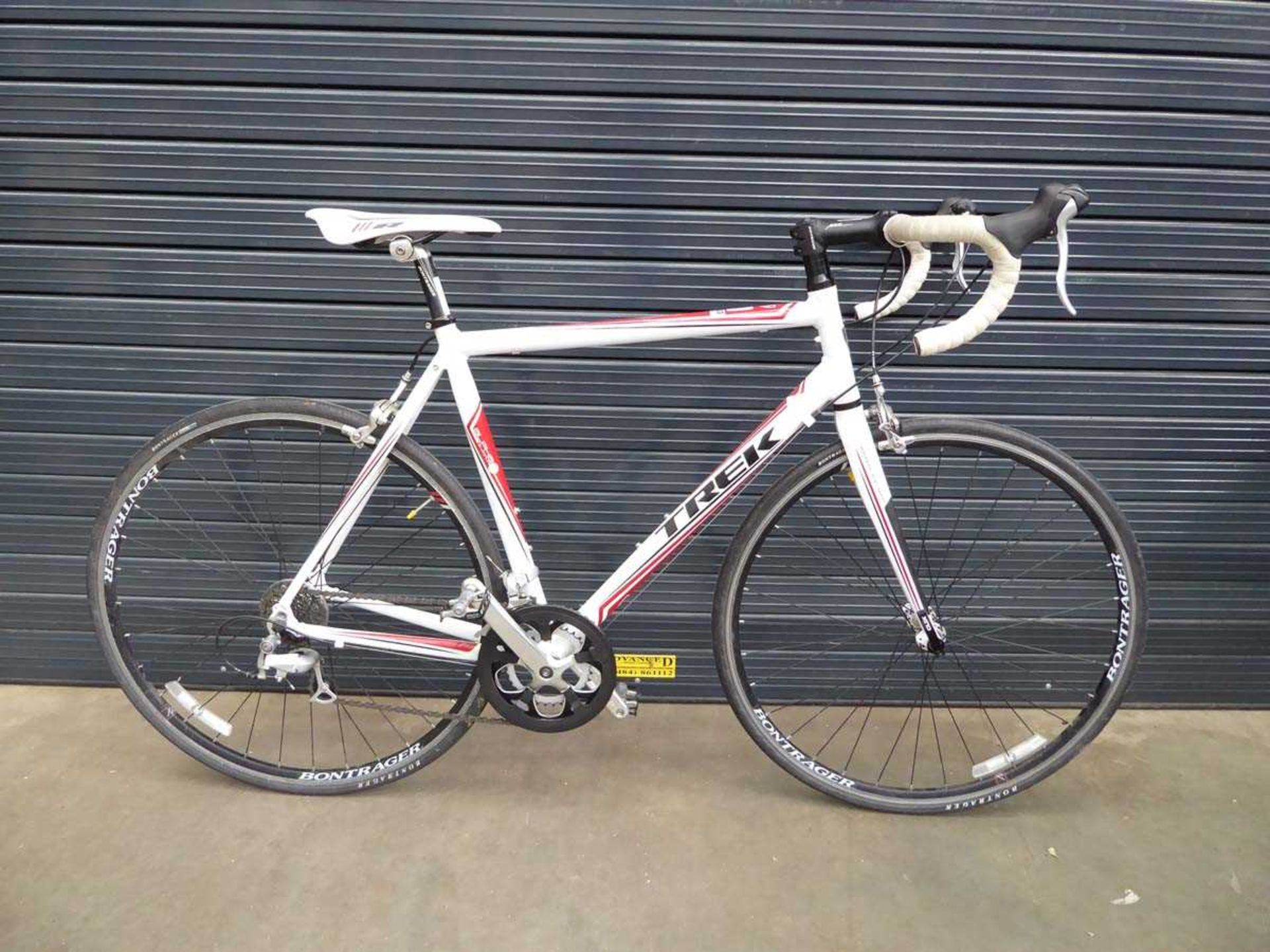 Trek white and red racing cycle
