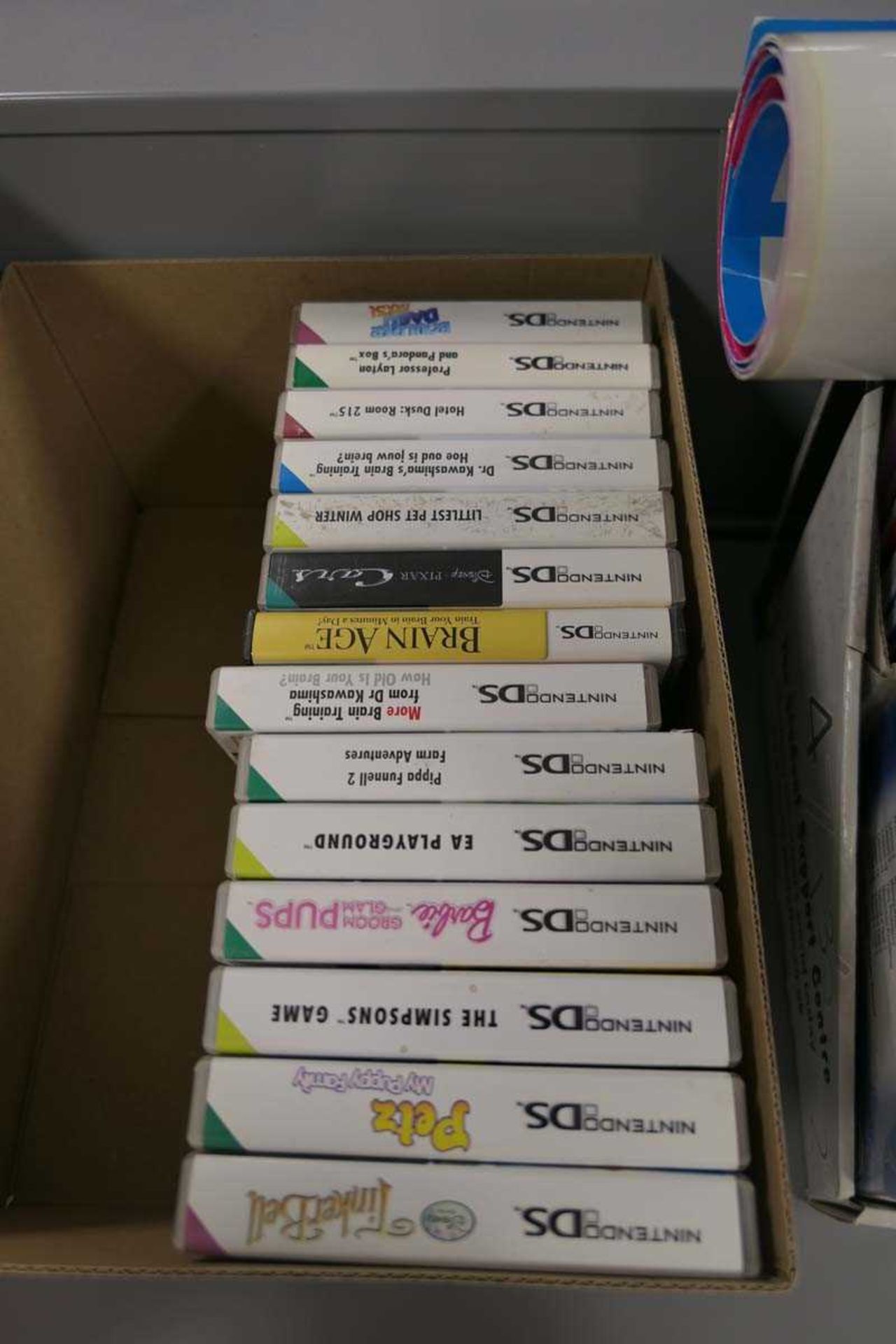 Box containing Nintendo DS games